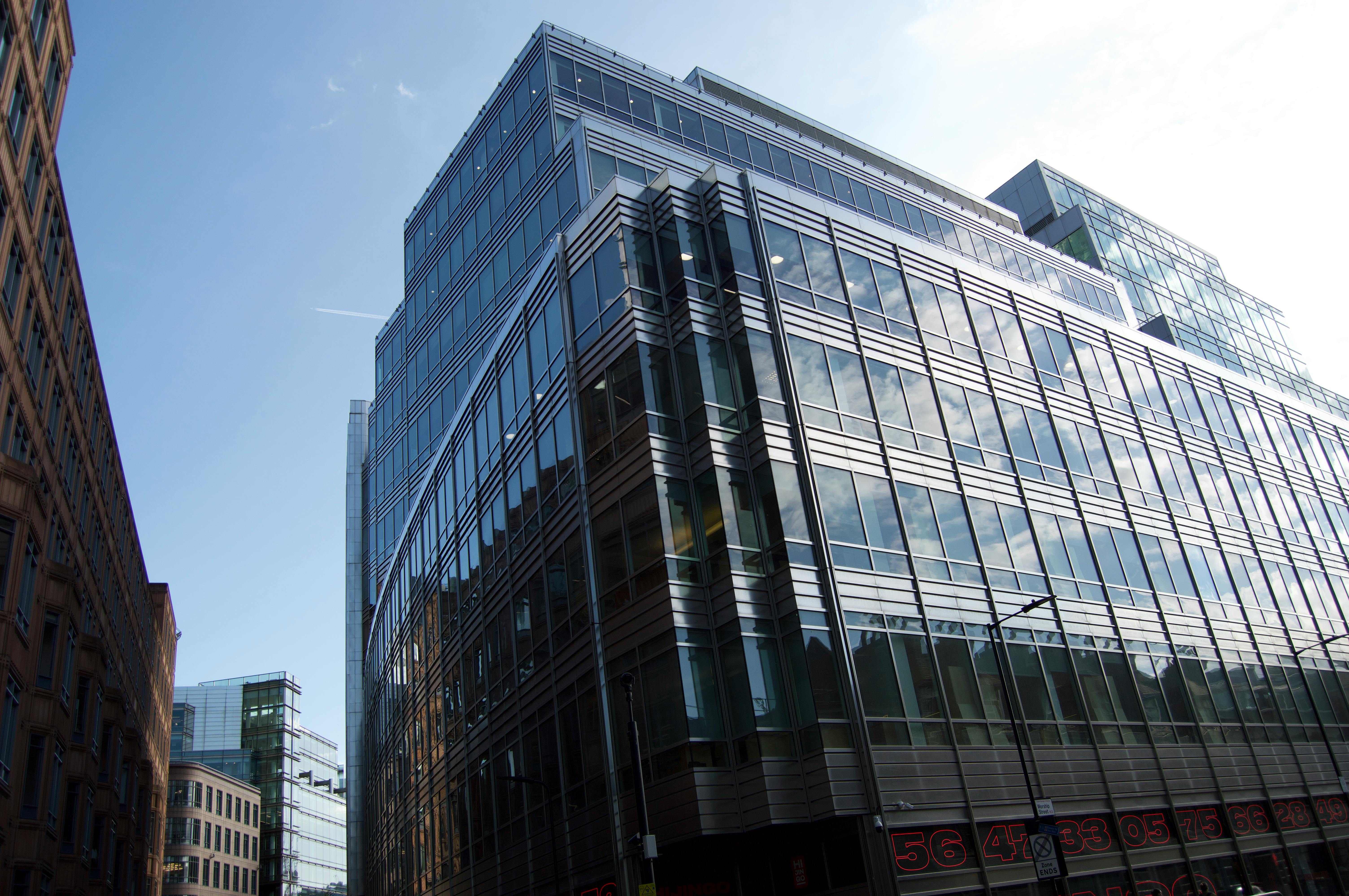 Clear Sky over Buildings Glass Walls · Free Stock Photo