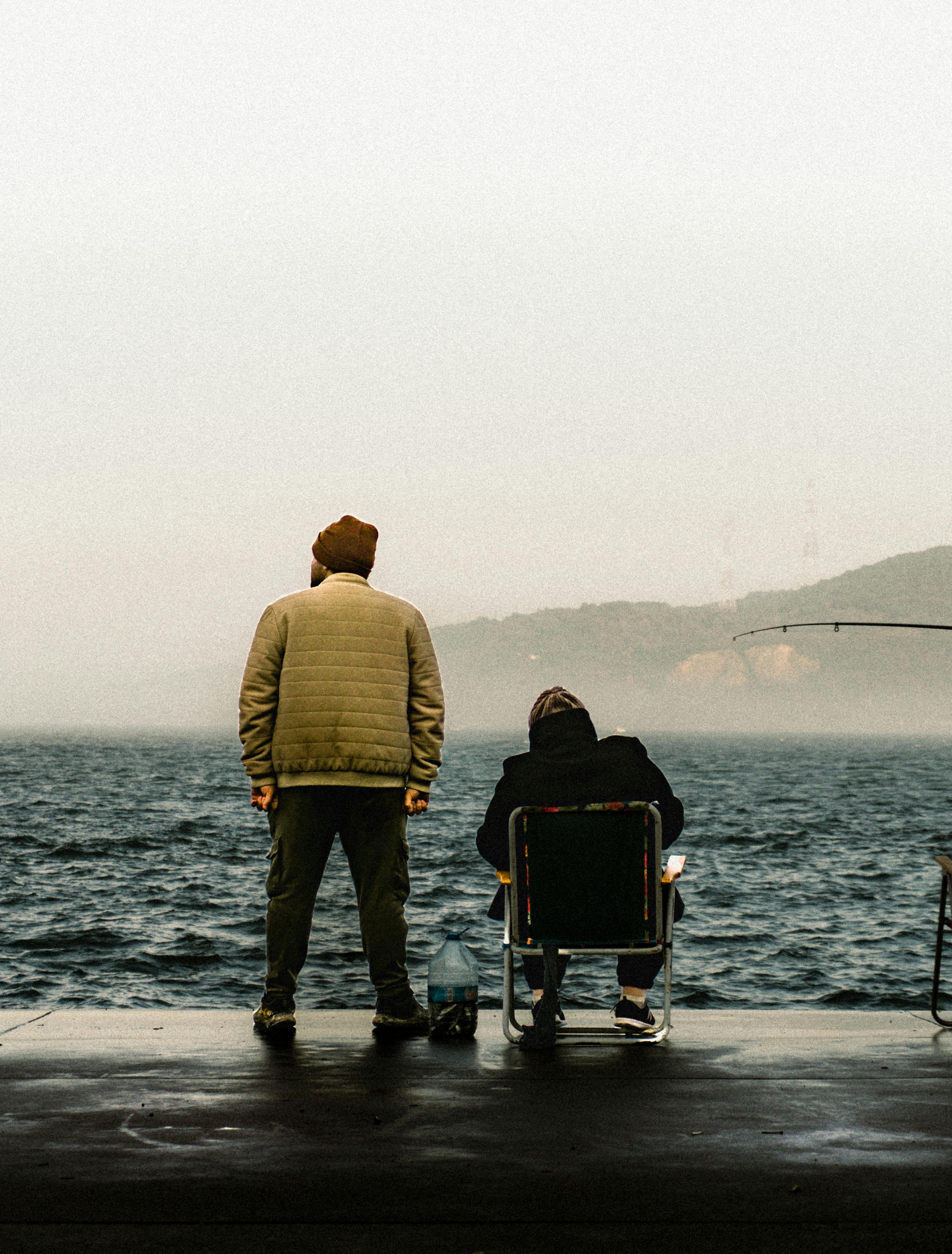Two Men Fishing in the Sea · Free Stock Photo