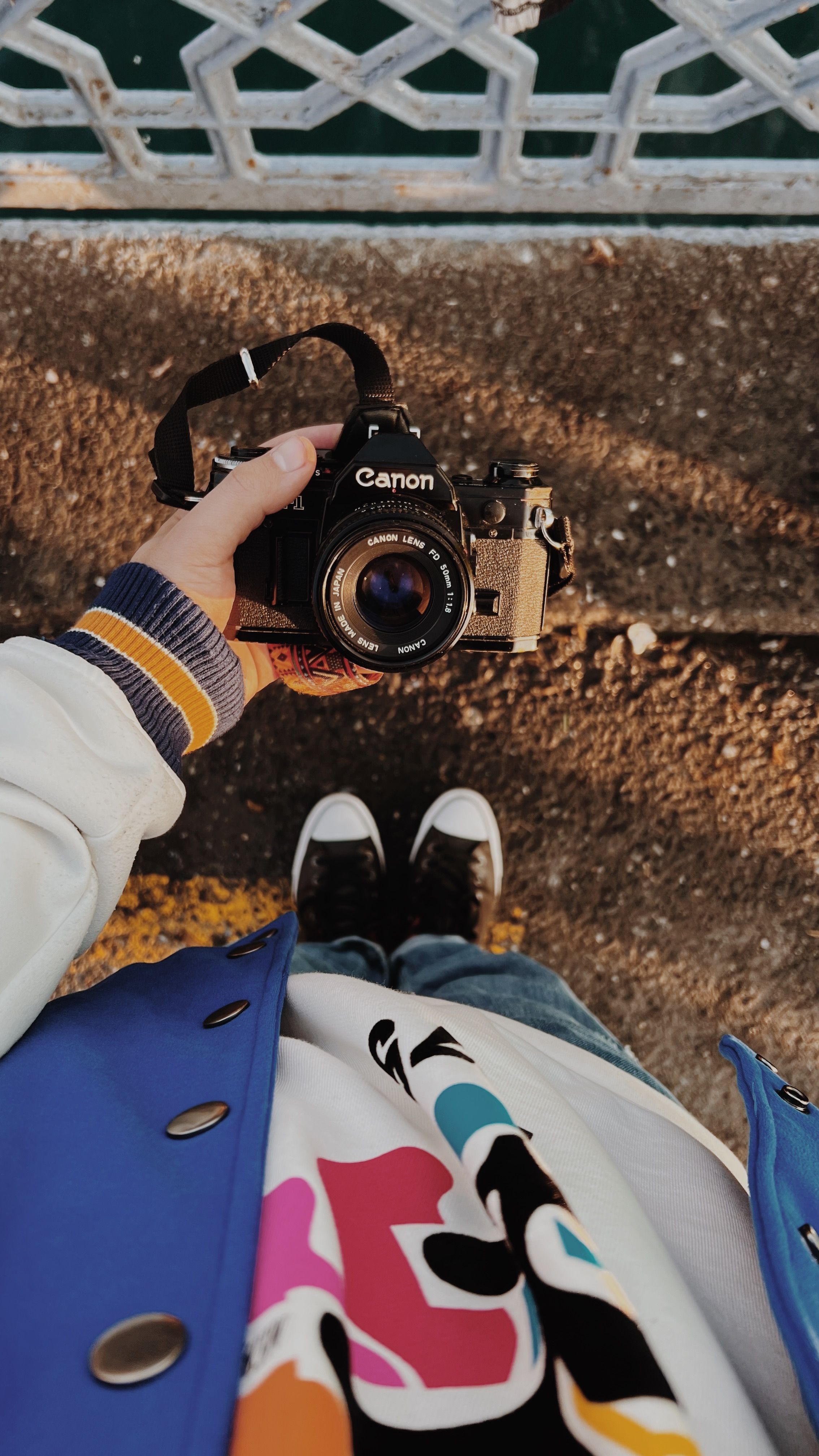 Hand on Book near Bag · Free Stock Photo
