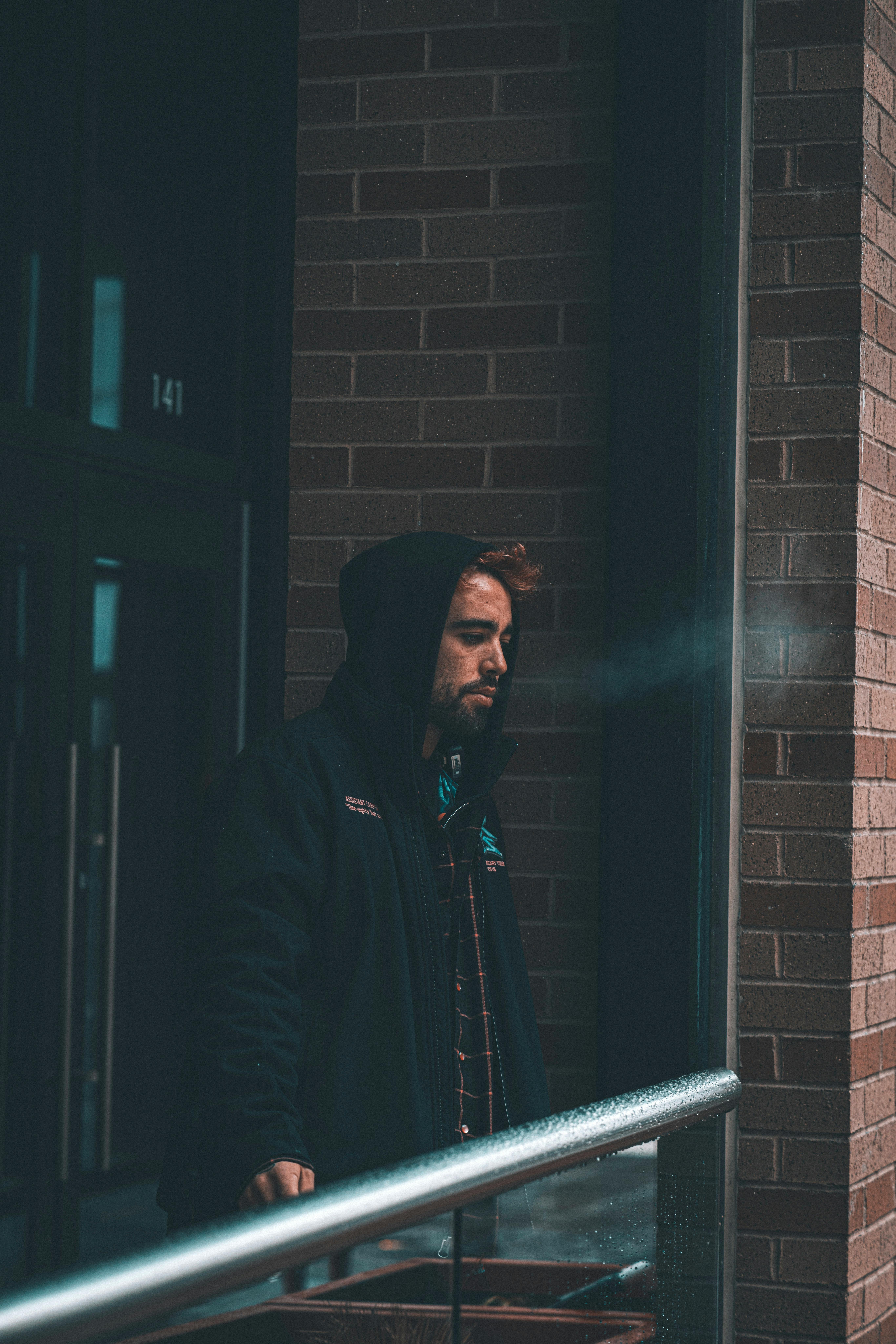 Standing Man Smoking Cigarette · Free Stock Photo