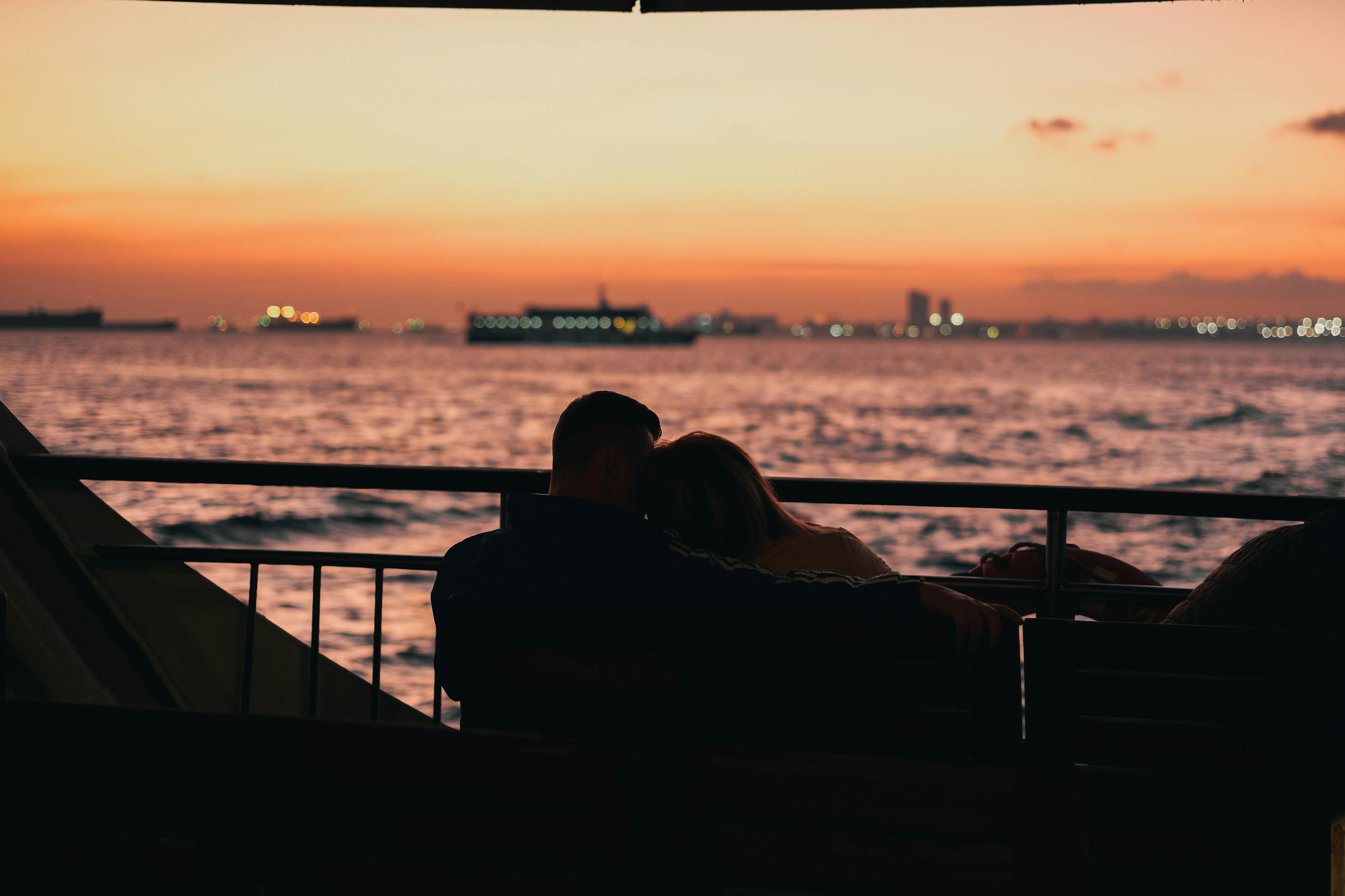 Couple Sitting at the Sea · Free Stock Photo