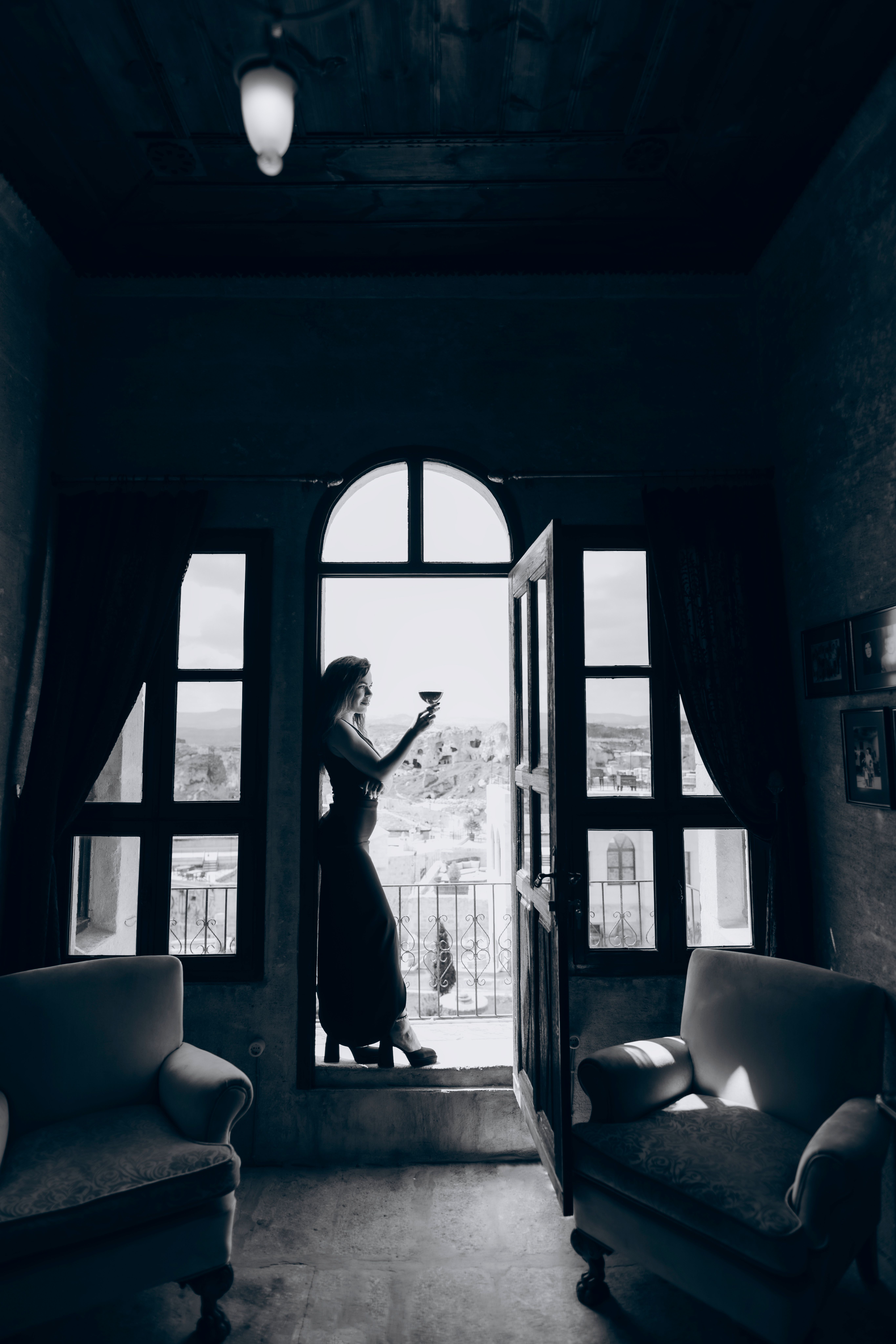Woman in a Window behind a Curtain · Free Stock Photo