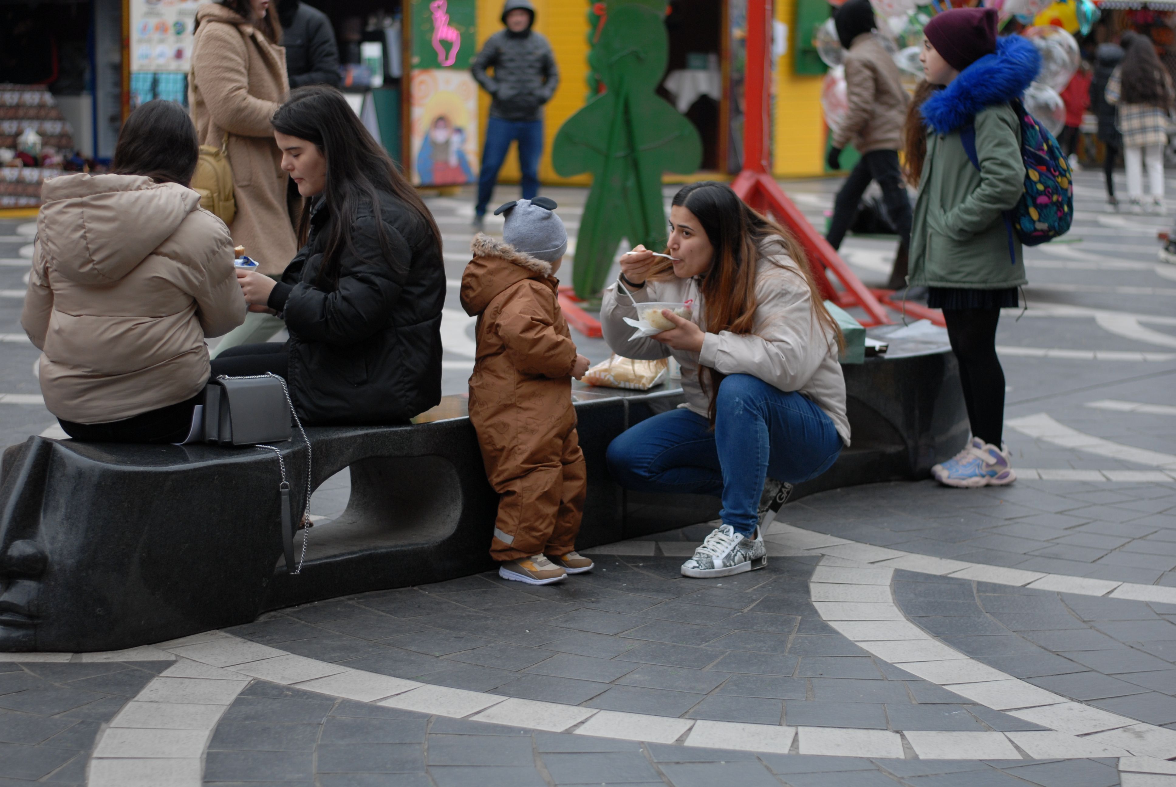 People Eating on a Town Square · Free Stock Photo