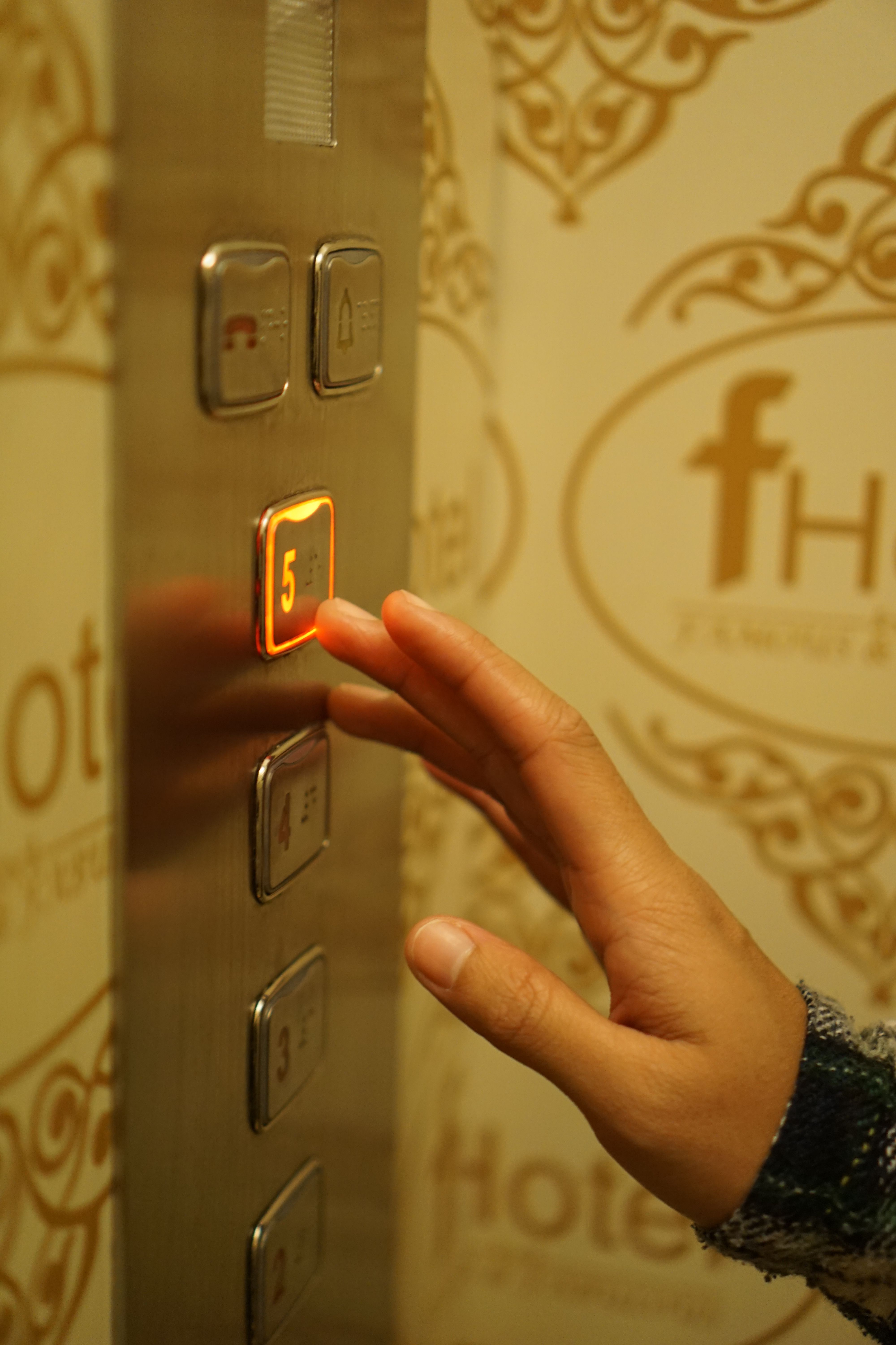 Elegant Woman in Elevator · Free Stock Photo