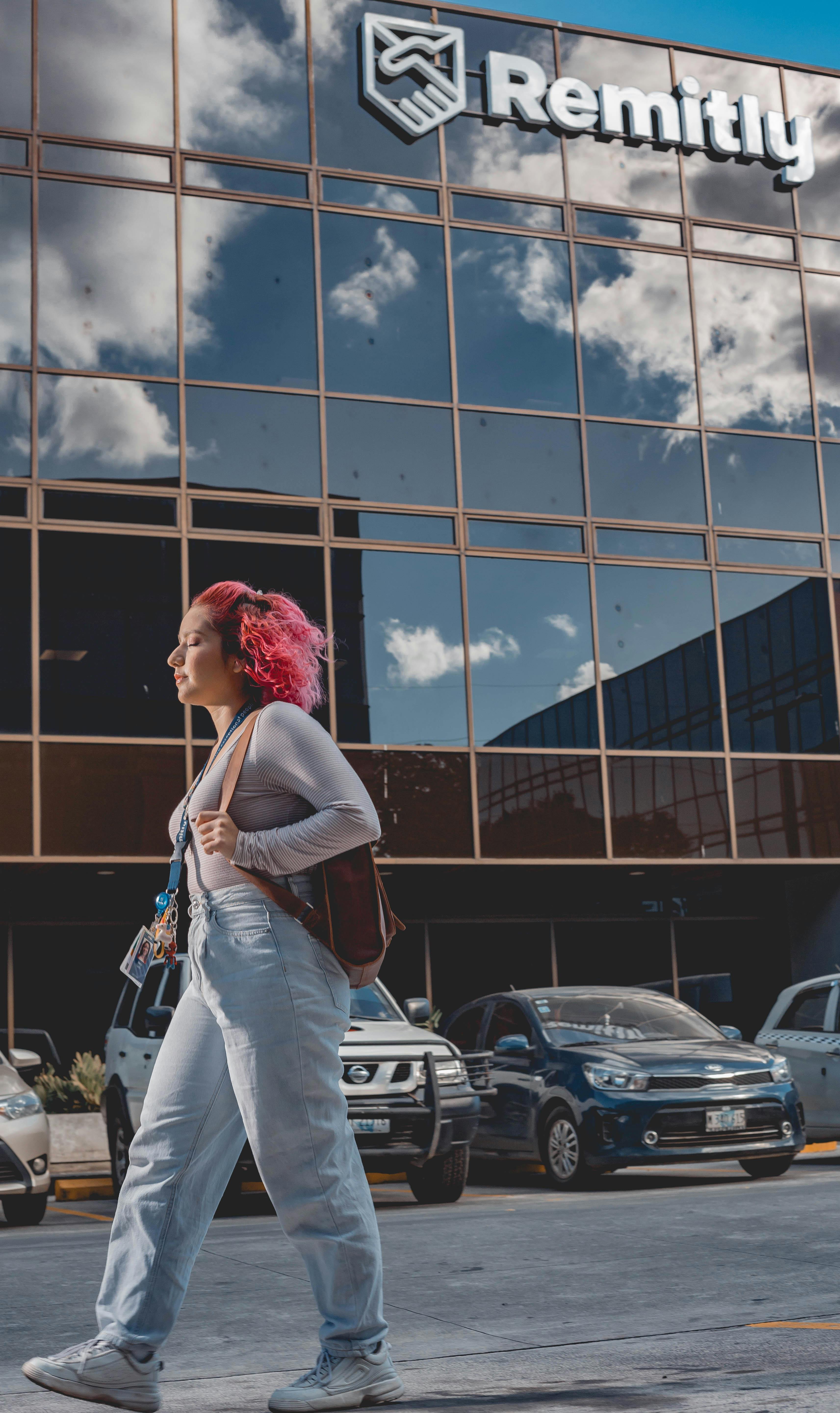 Casual Style Woman against Remitly Office Building · Free Stock Photo