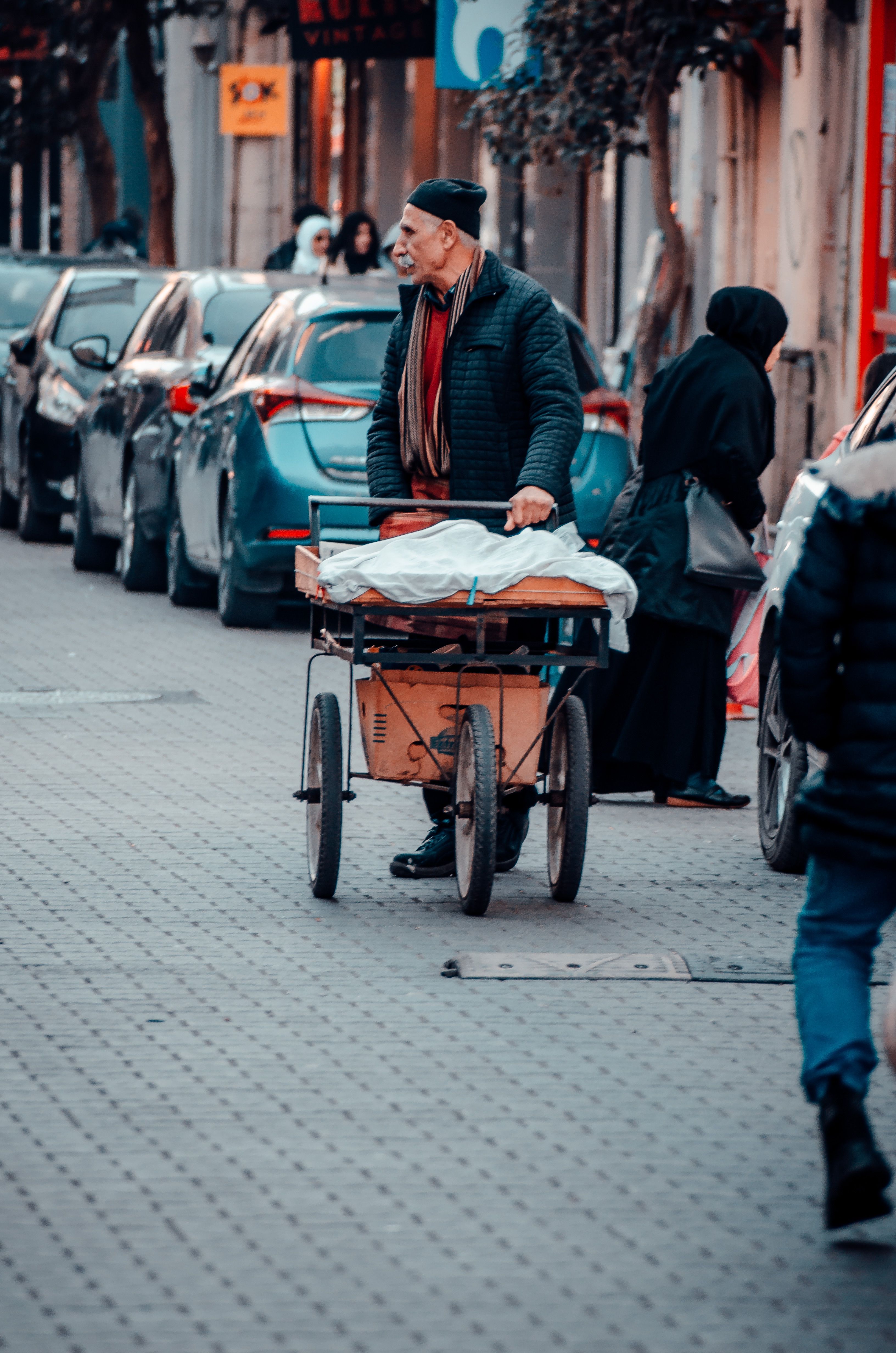 Man Walking with Trailer on Street · Free Stock Photo
