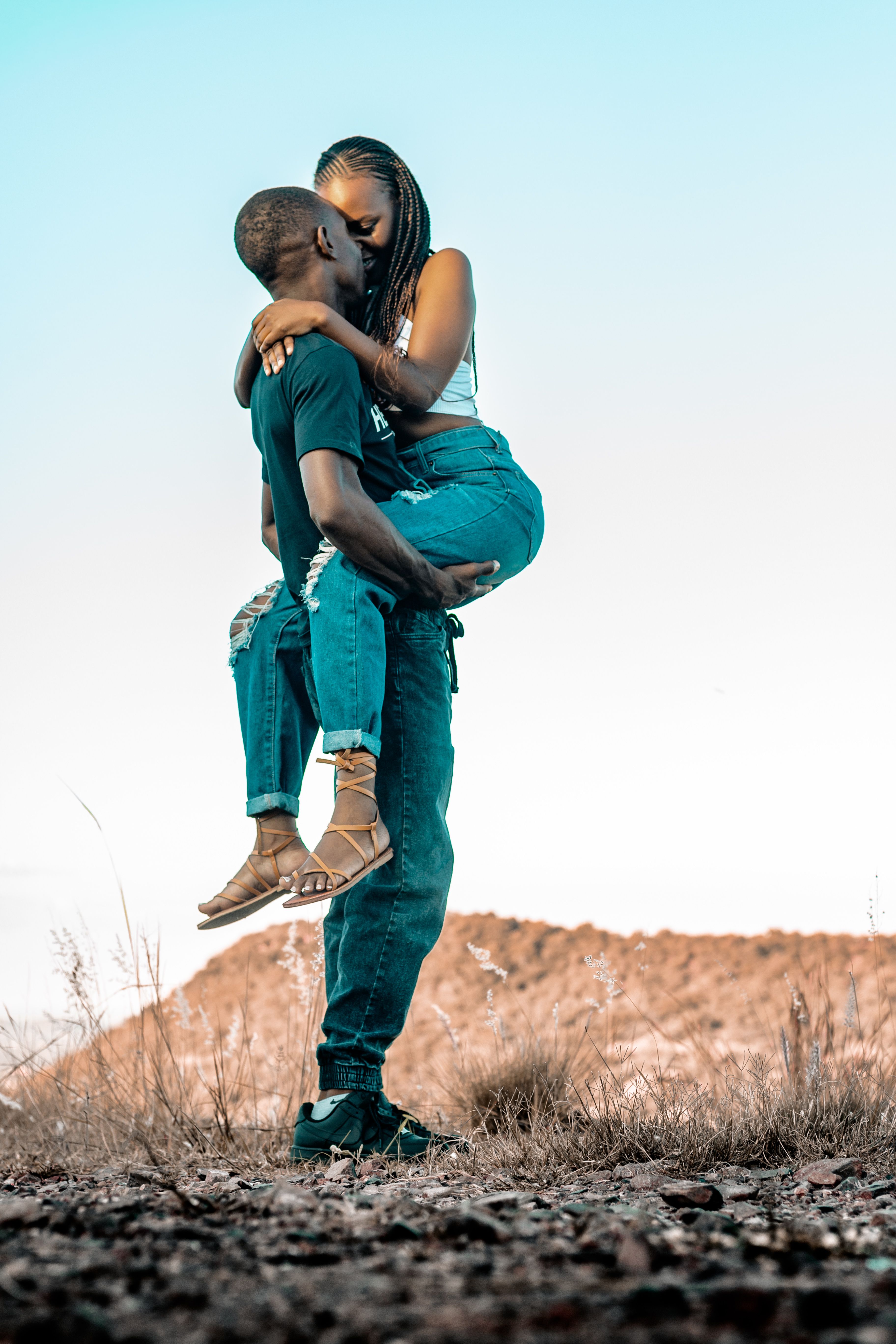 A Man Carrying His Partner · Free Stock Photo