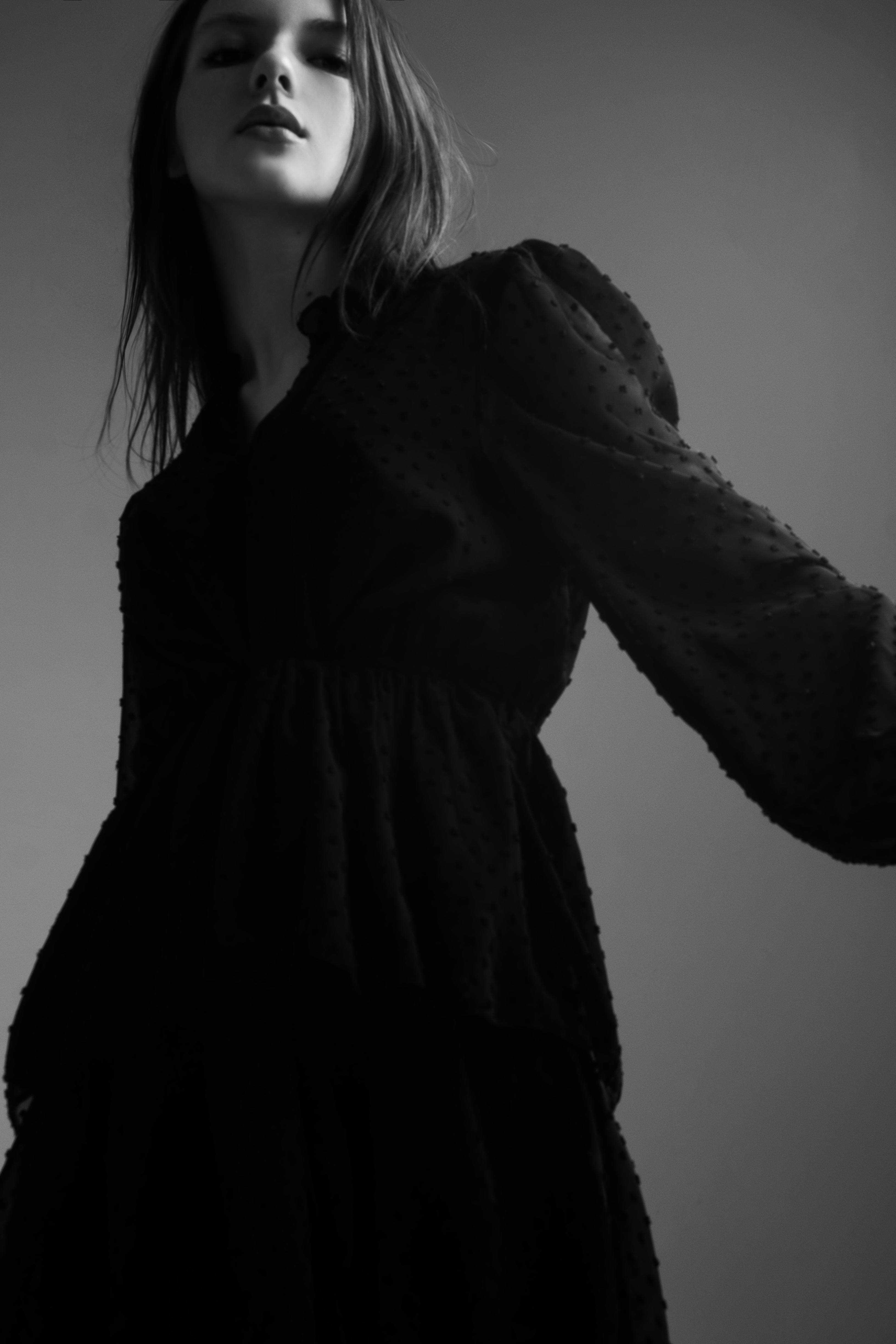 A Woman Wearing a Black Graduation Toga · Free Stock Photo