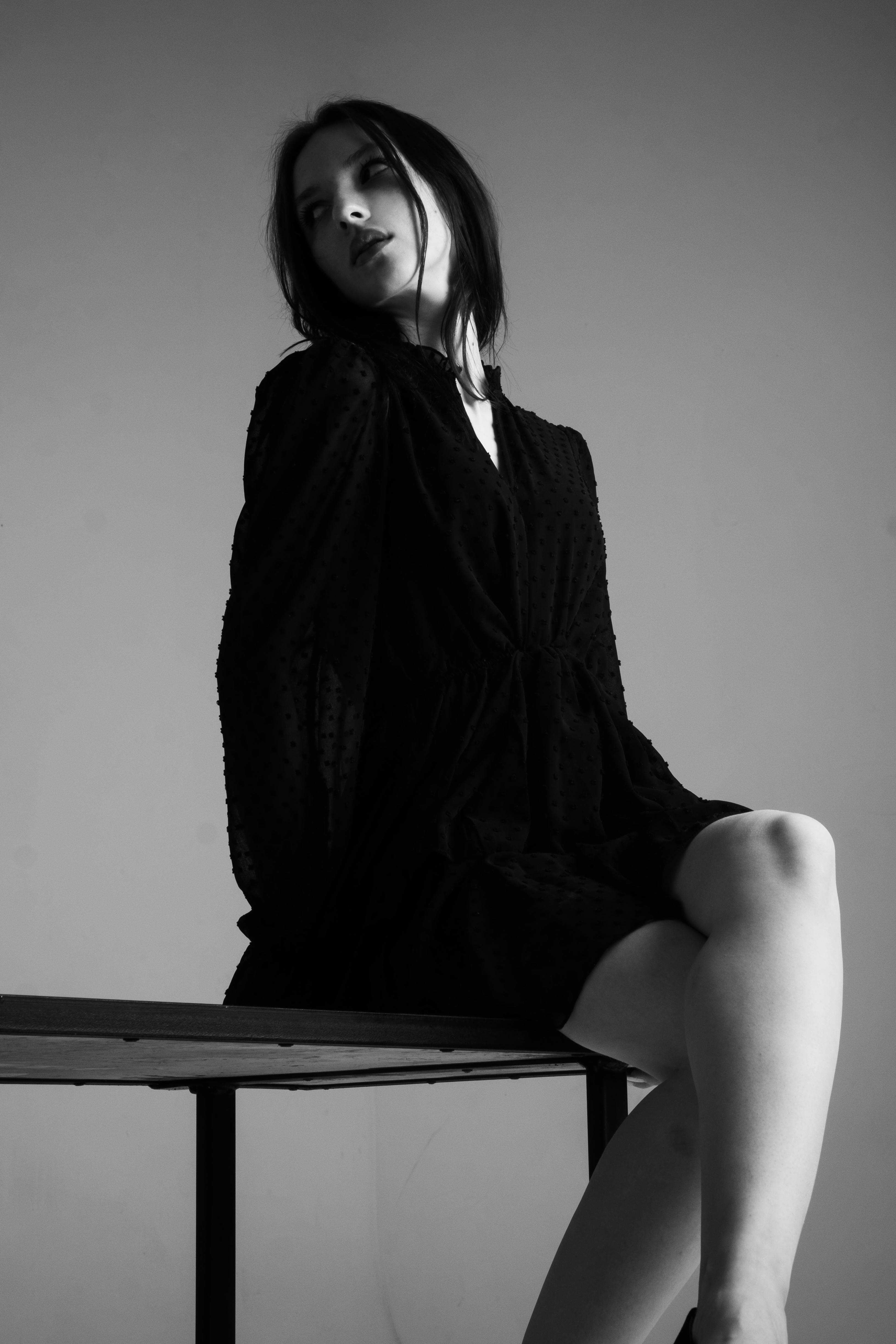 Woman Posing on Table · Free Stock Photo