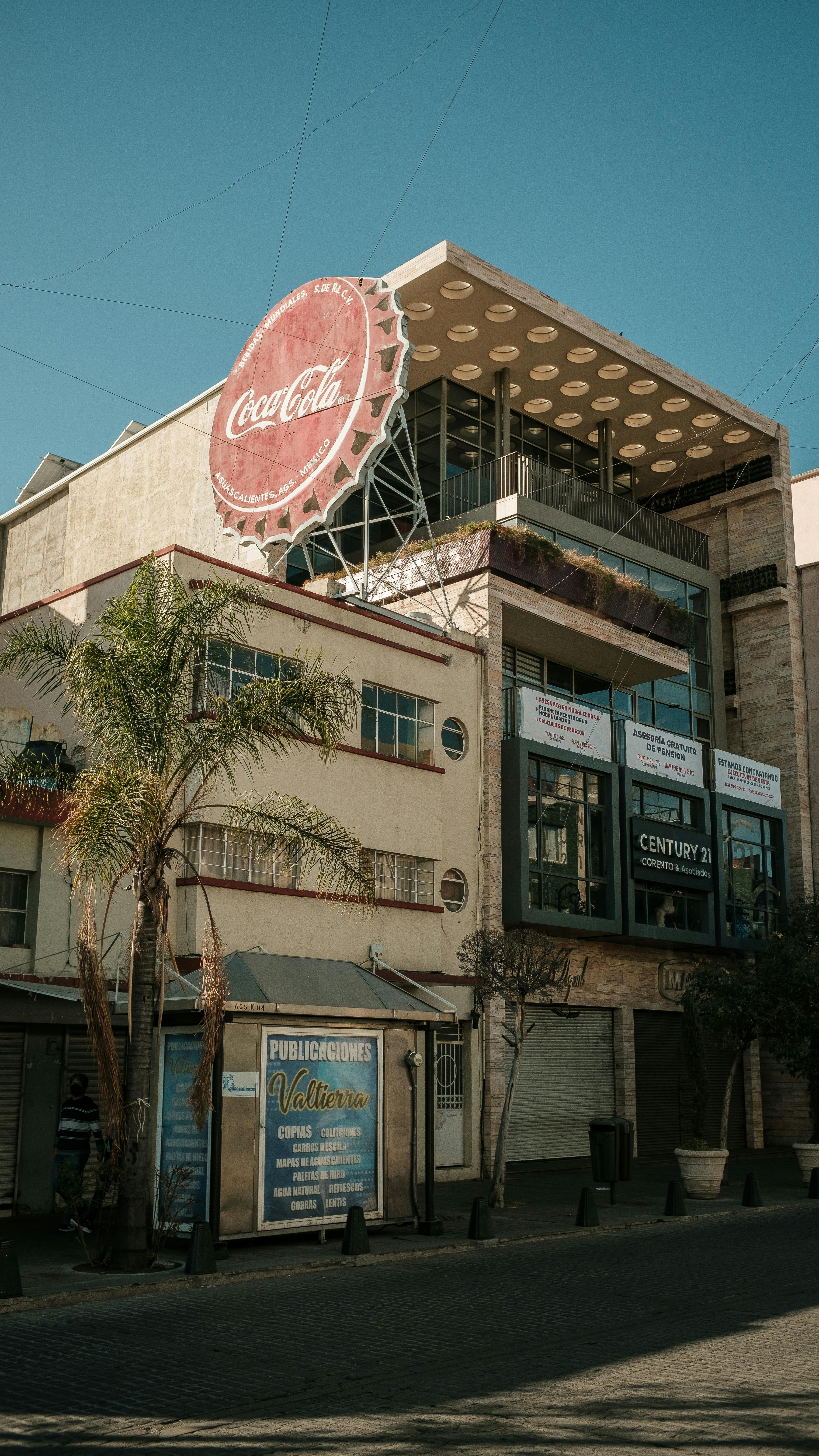 Coca Cola Logo on Building · Free Stock Photo