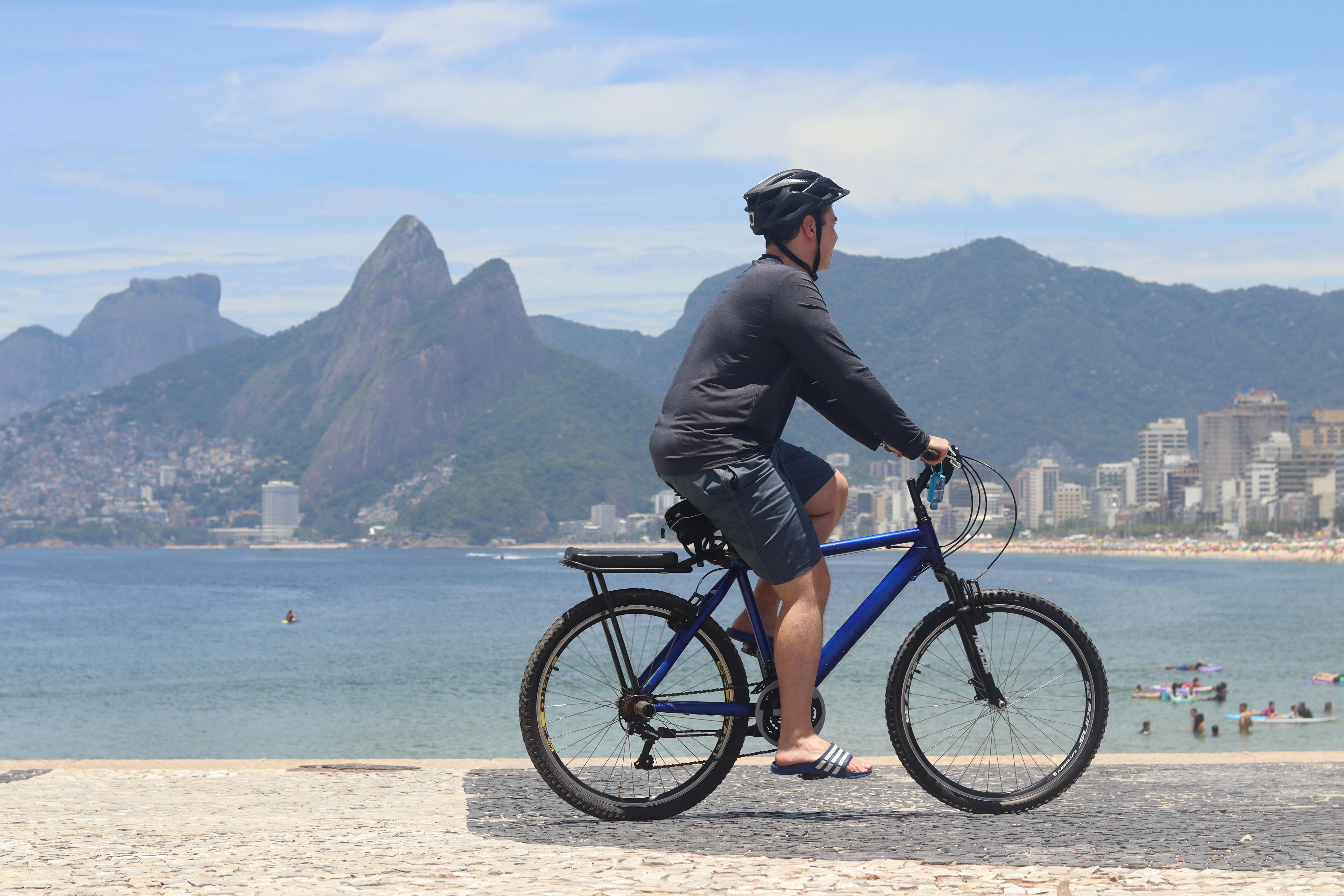 Man Riding on Bike at the Sea · Free Stock Photo
