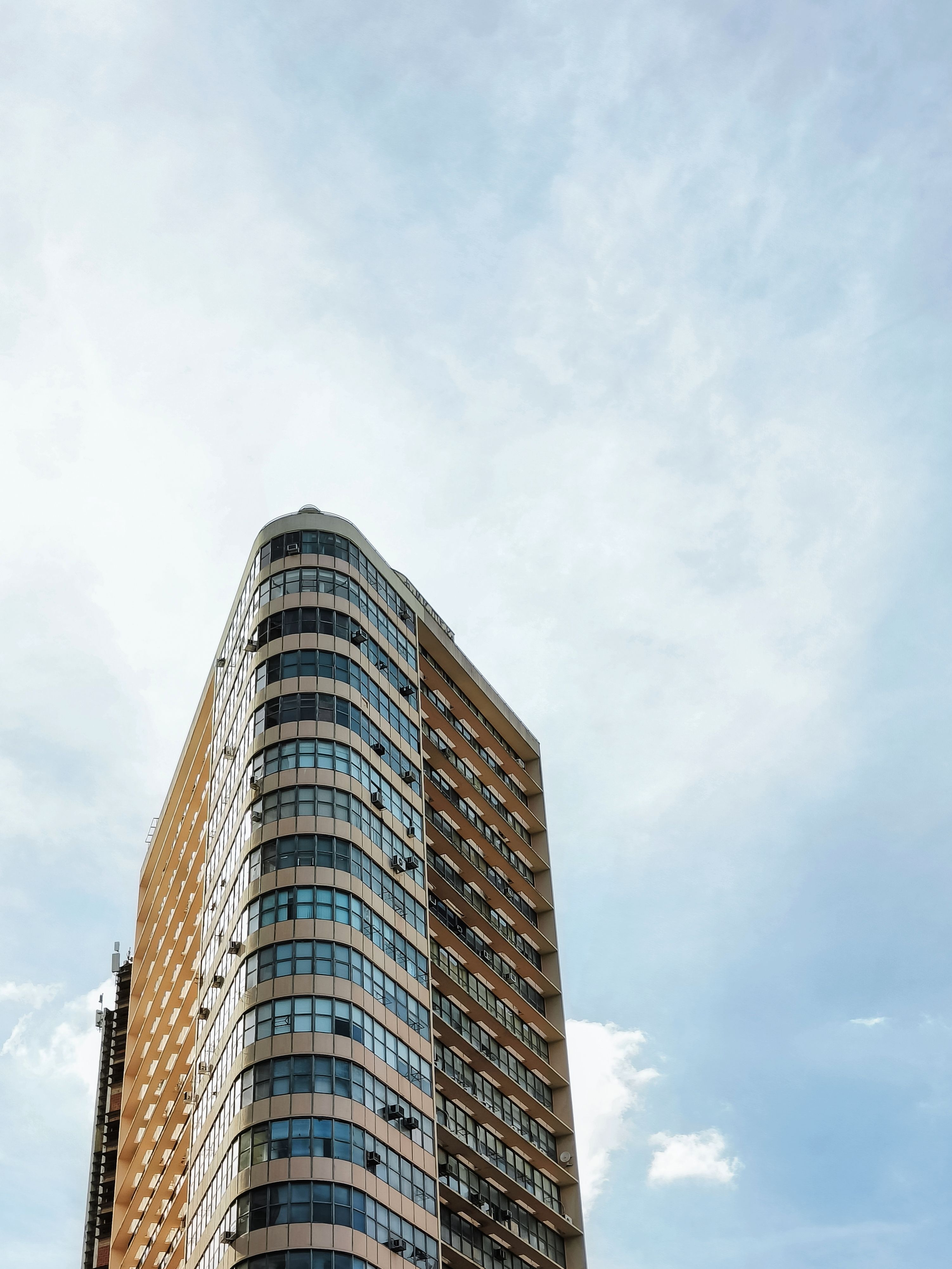 Modern Glass Skyscraper with Lights on Dark Sky Background · Free Stock ...