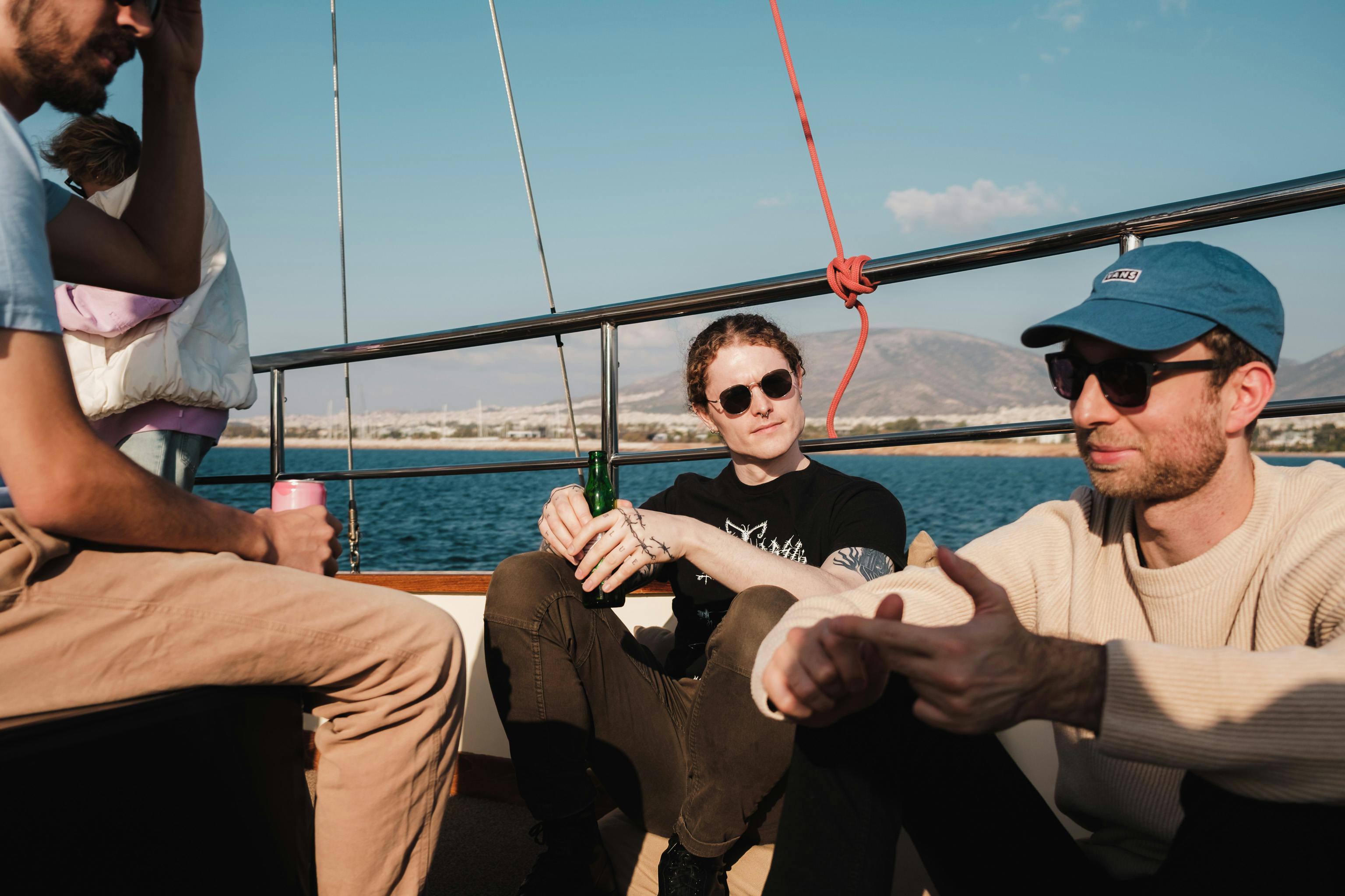 Friends Drinking Beer on a Yacht · Free Stock Photo