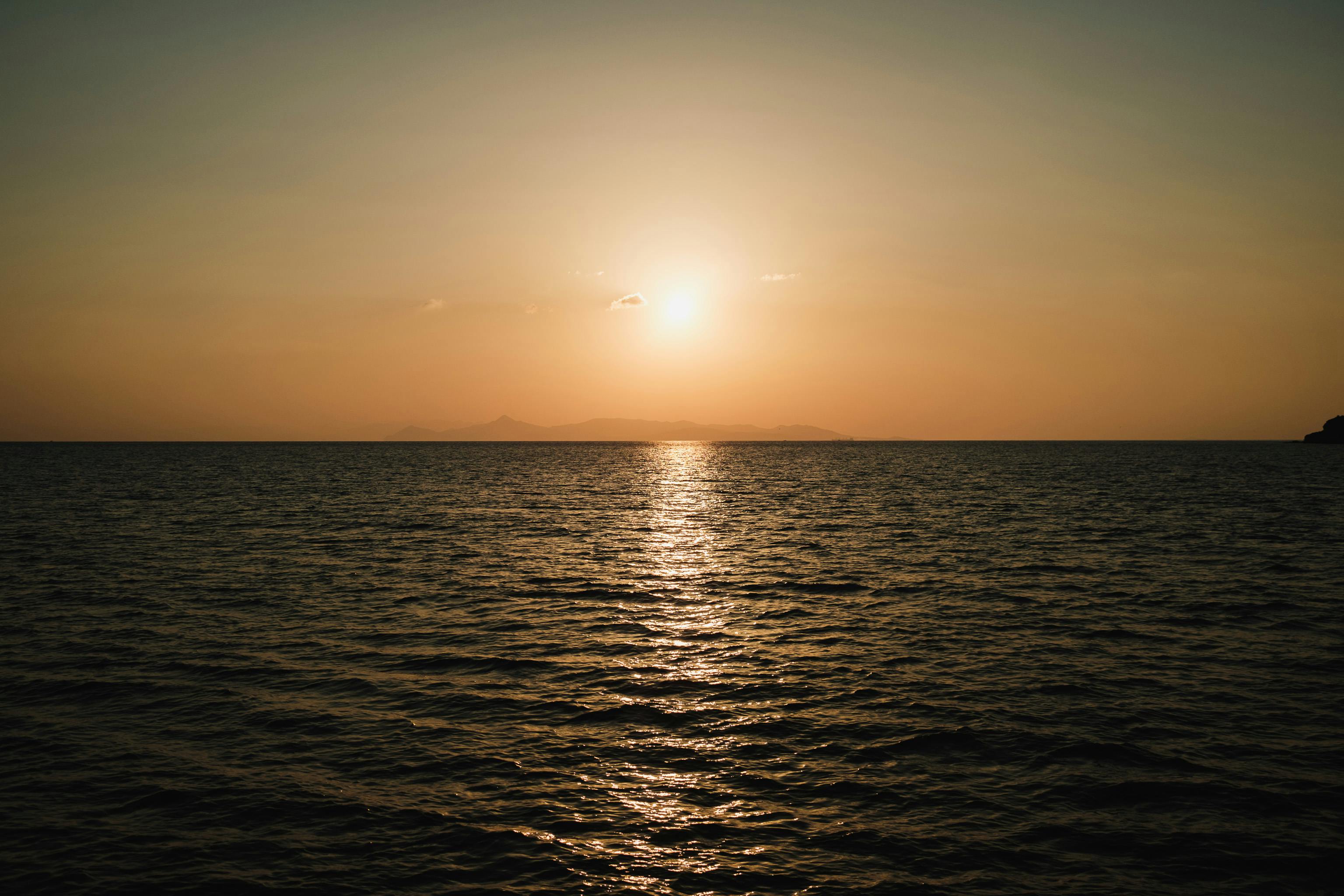 Sun Setting over the Mountains · Free Stock Photo