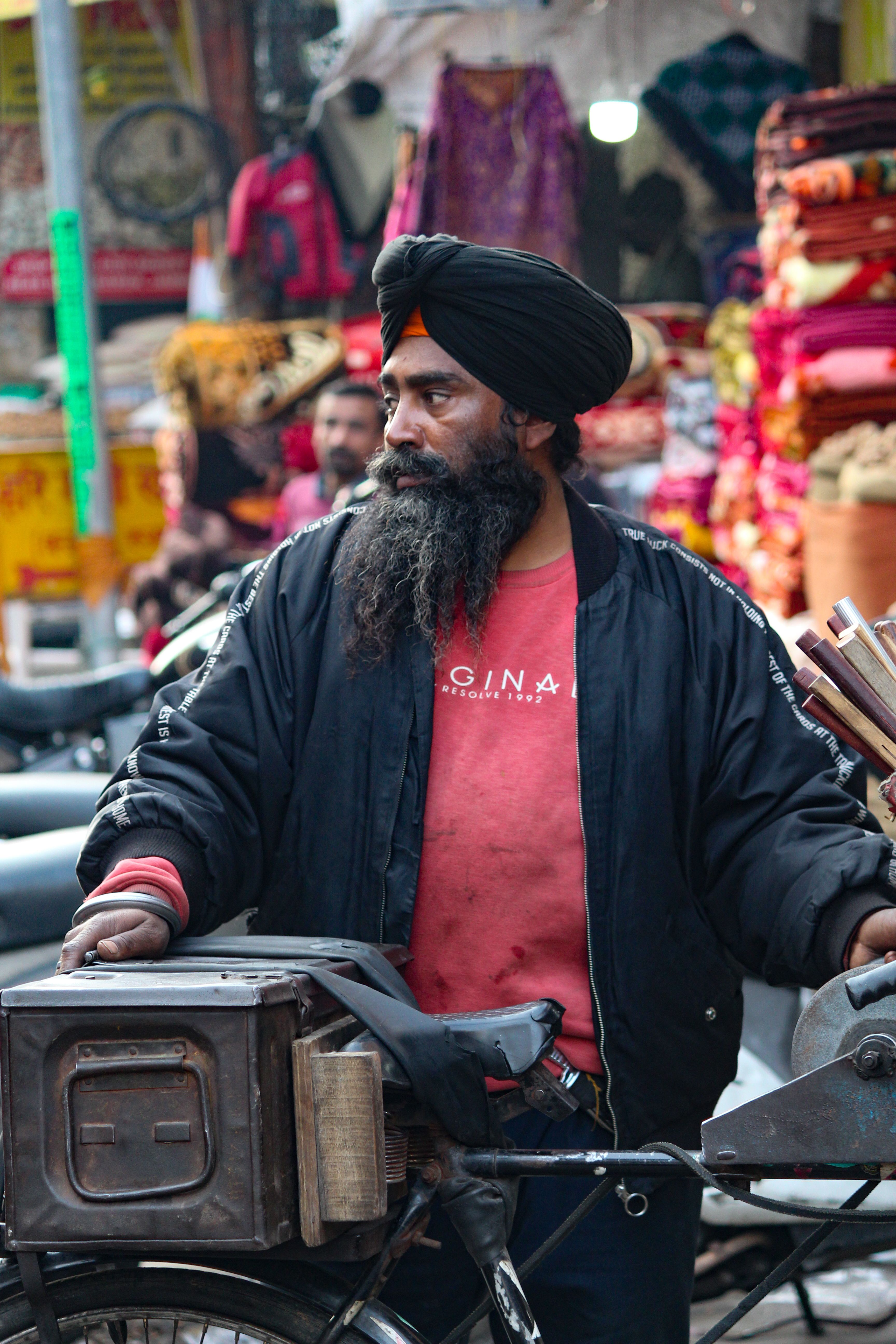 Bearded Man with a Turban Standing Next to His Bicycle · Free Stock Photo