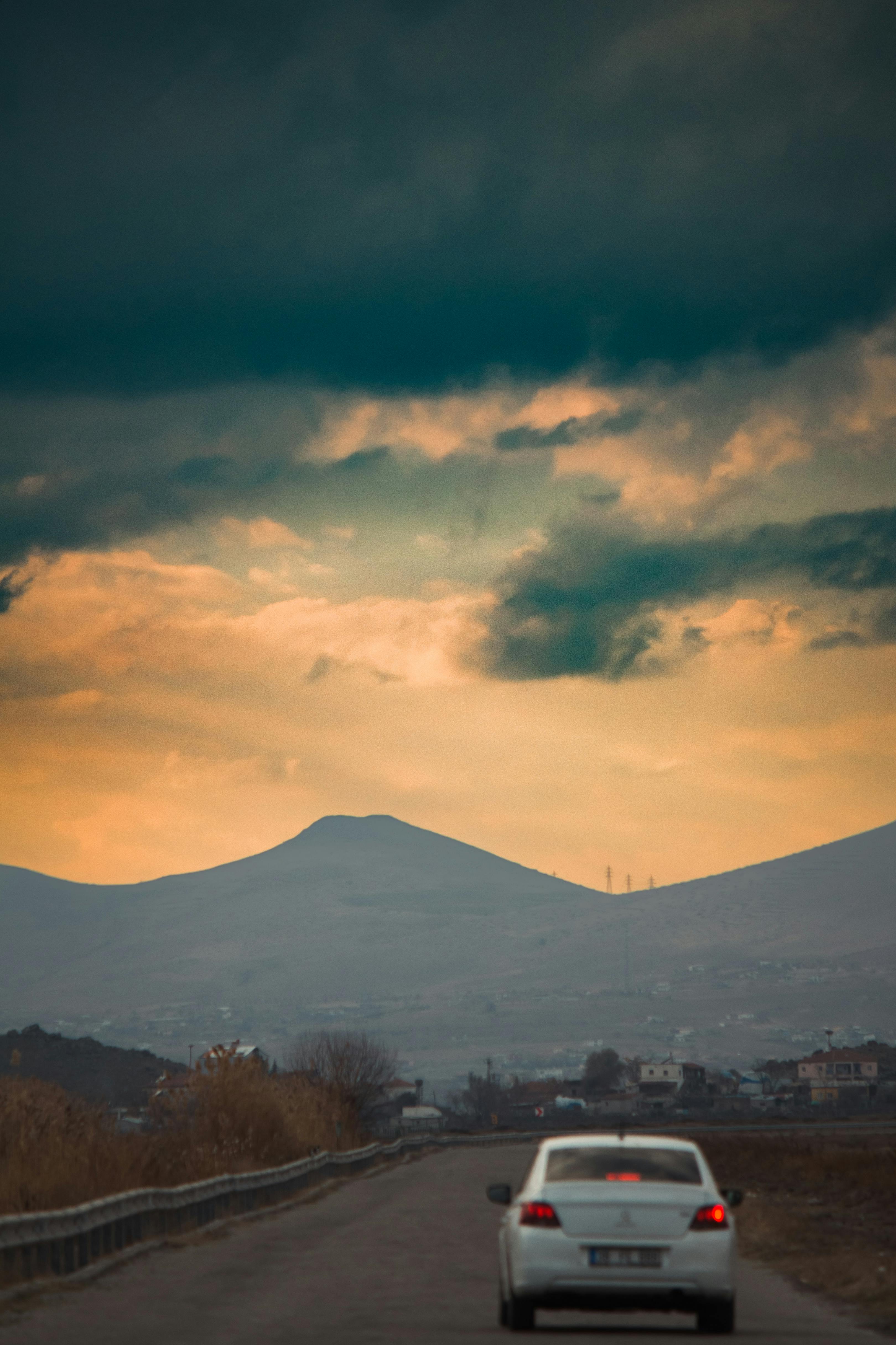 Back View of a White Car on the Road · Free Stock Photo