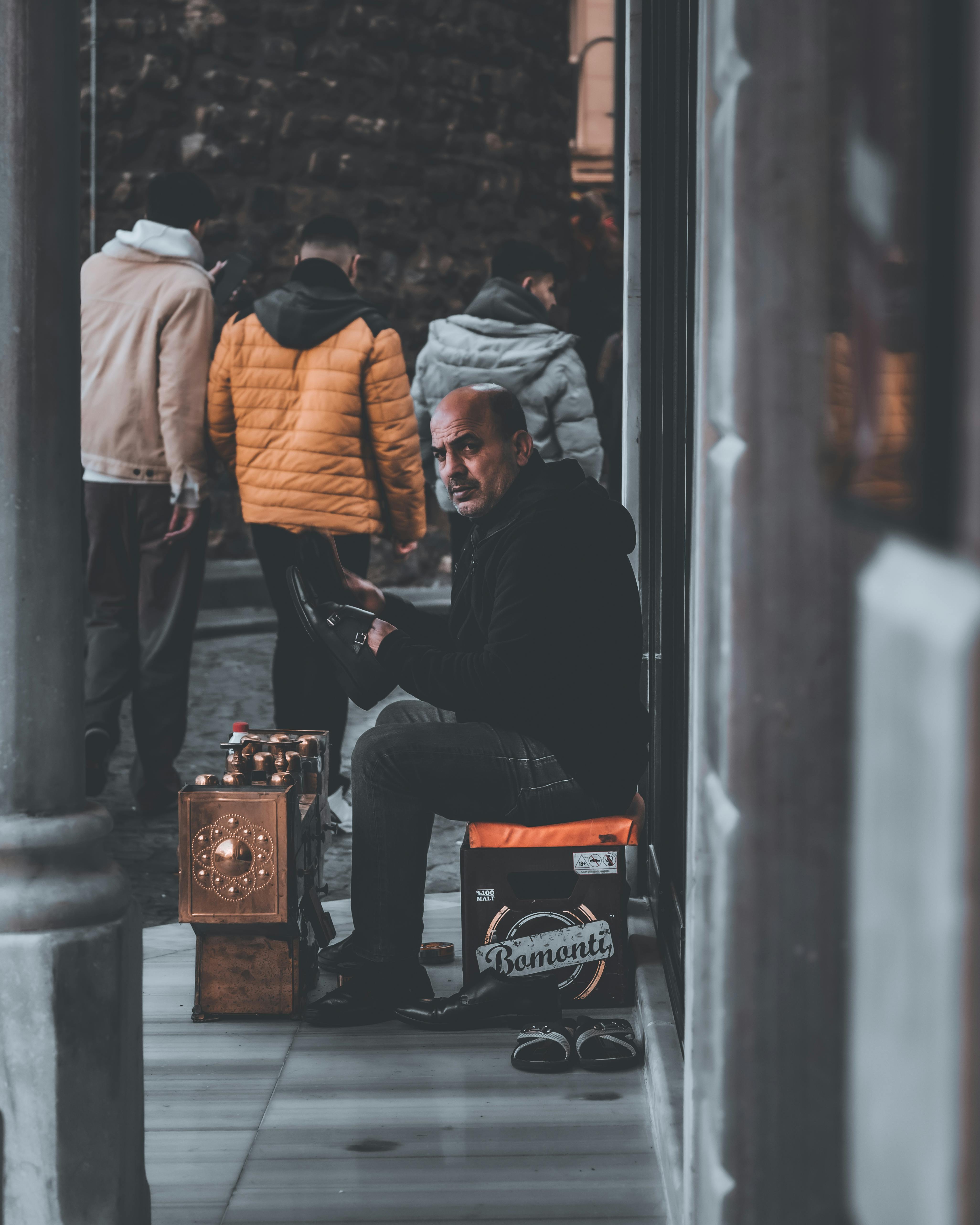 Old Man Selling on City Street · Free Stock Photo