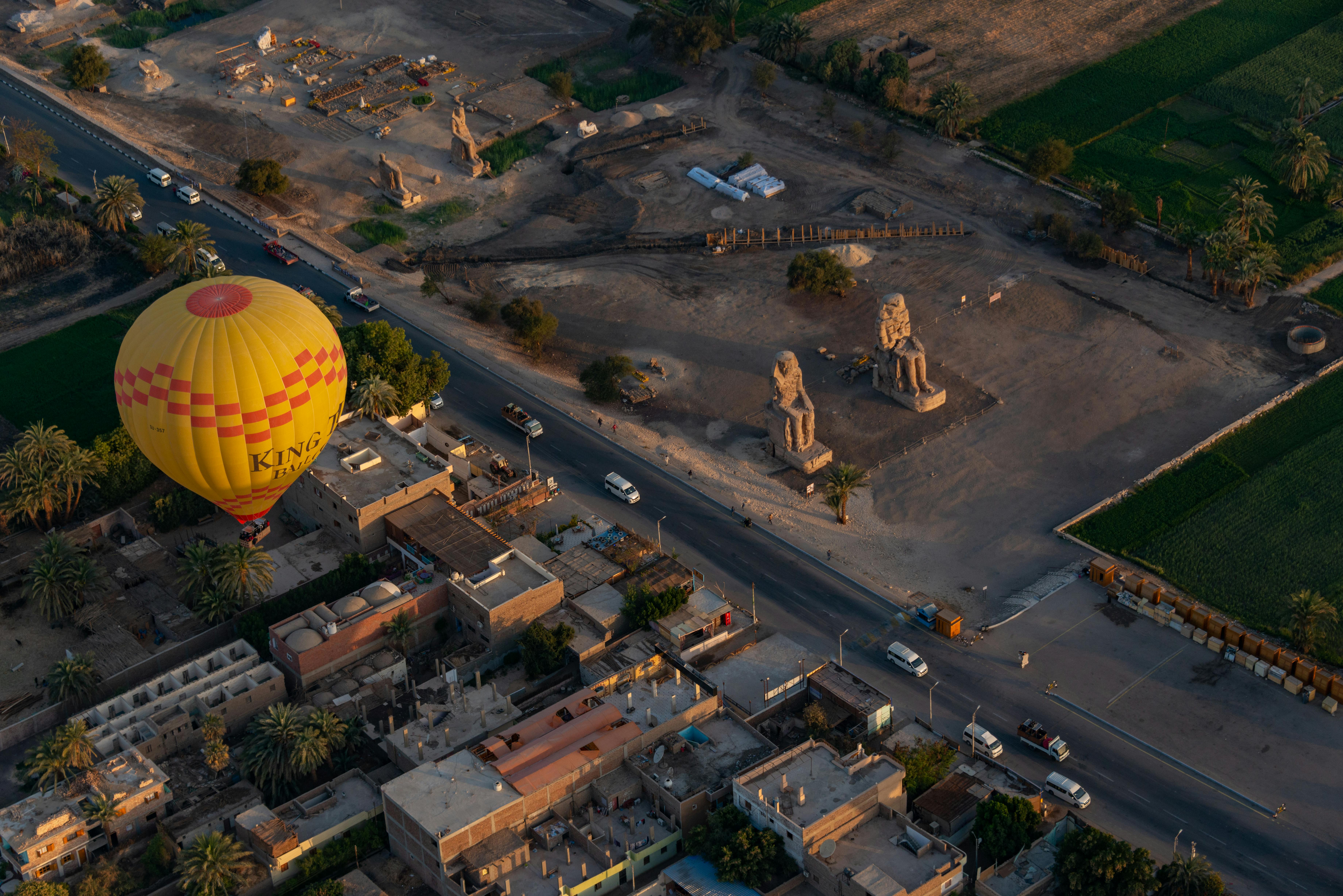 Balloons Flying over Town · Free Stock Photo