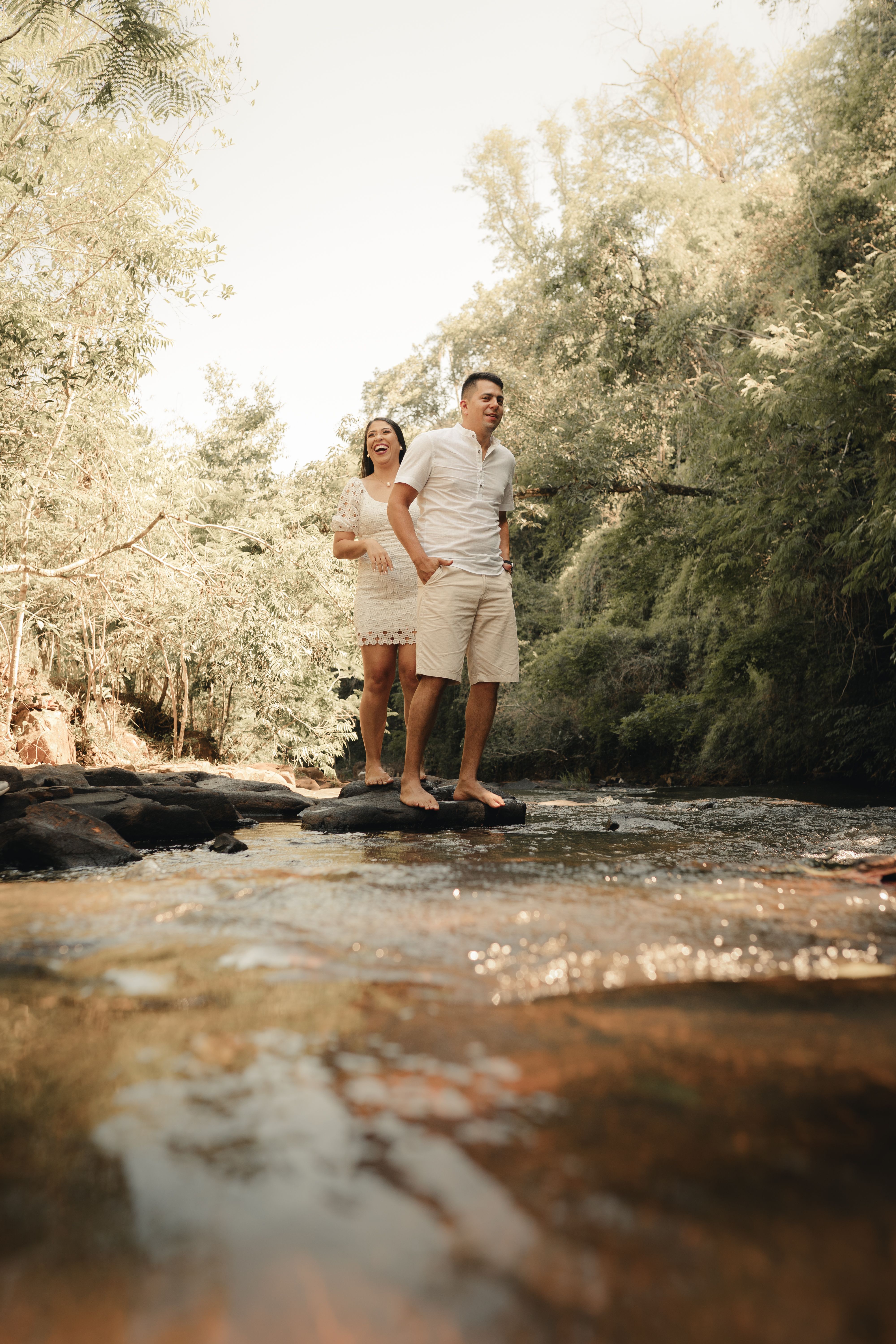 Couple Standing on Stream in Forest · Free Stock Photo