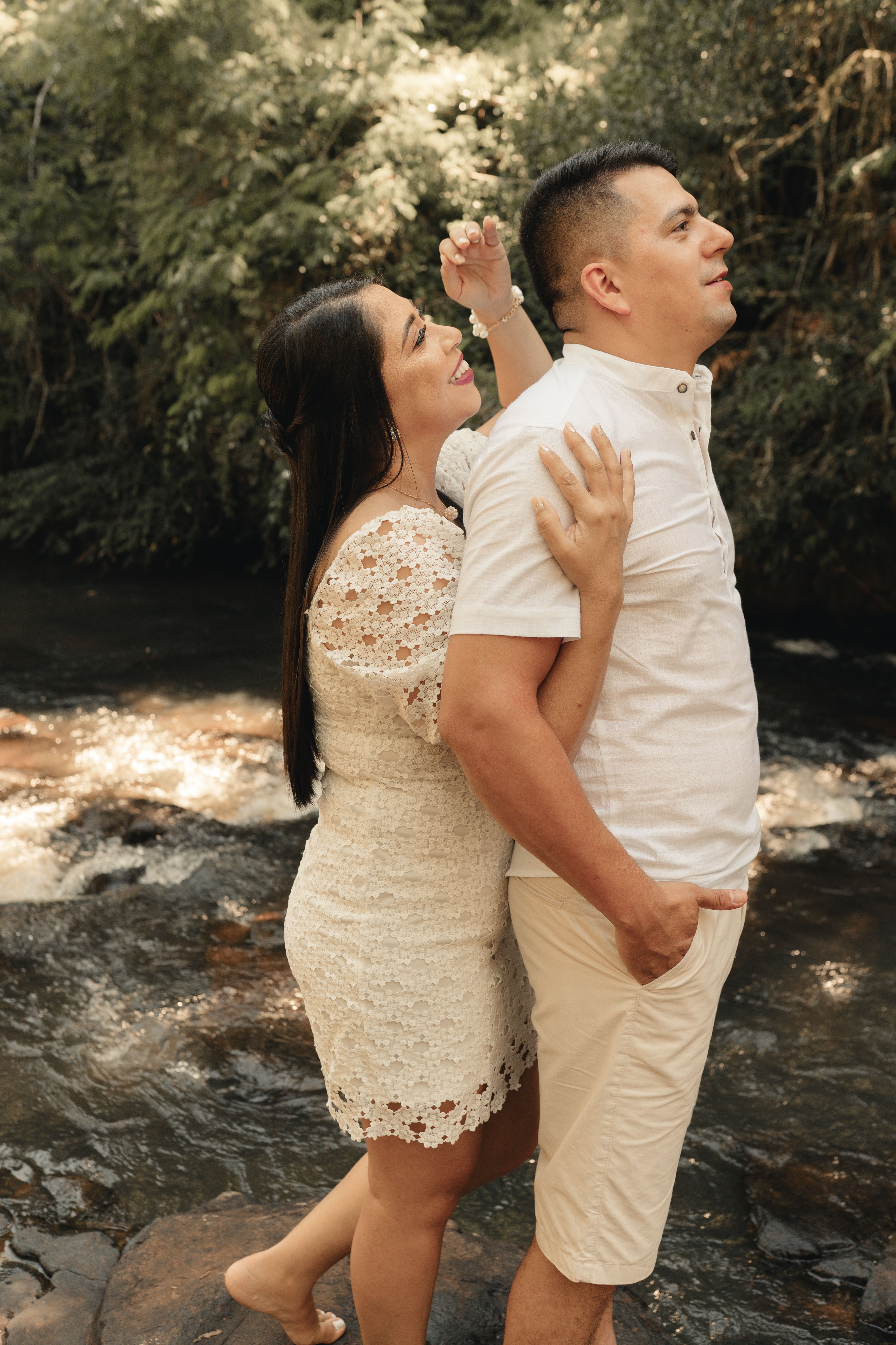 A Playful Couple Over the Stream · Free Stock Photo