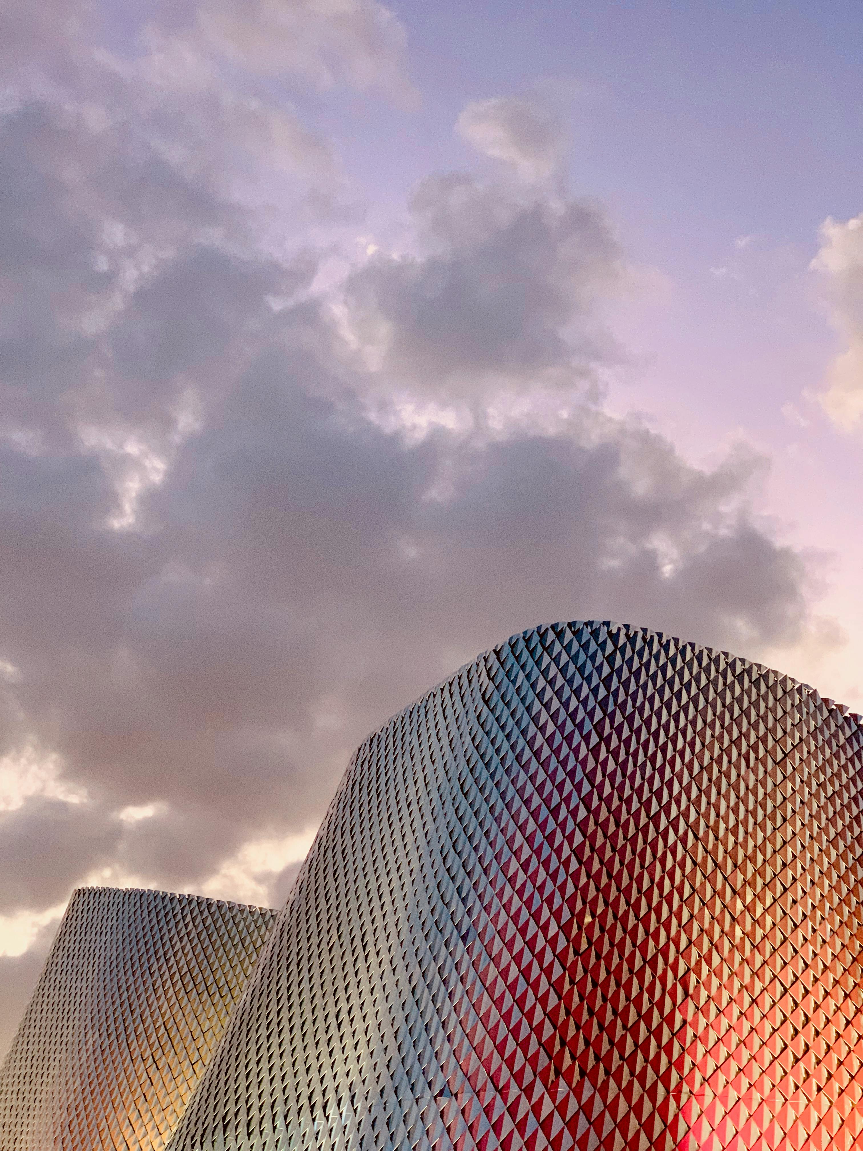 Clouds over Buildings Silver Walls · Free Stock Photo