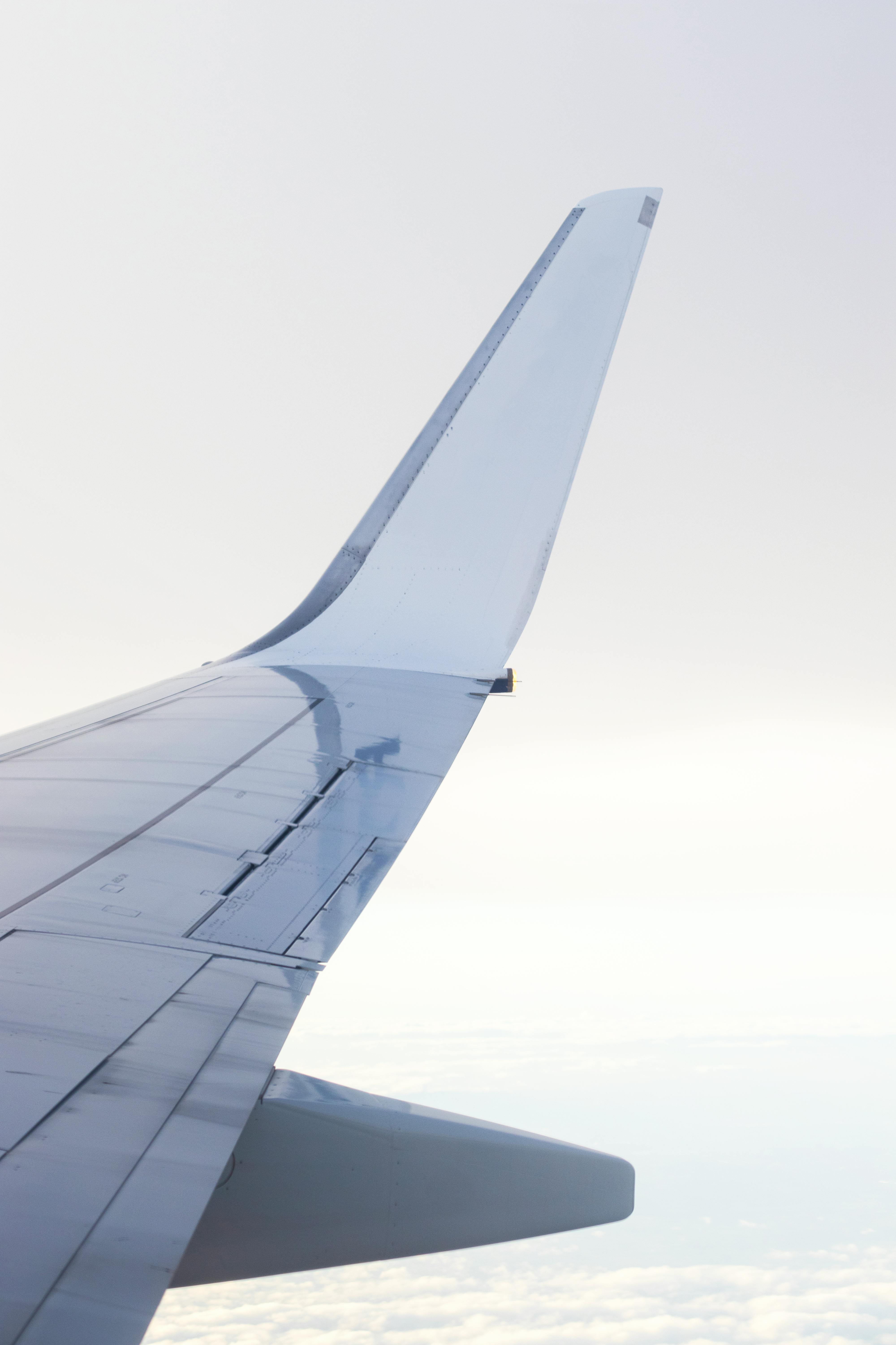 Architectural Photography of White Aircraft Wing · Free Stock Photo