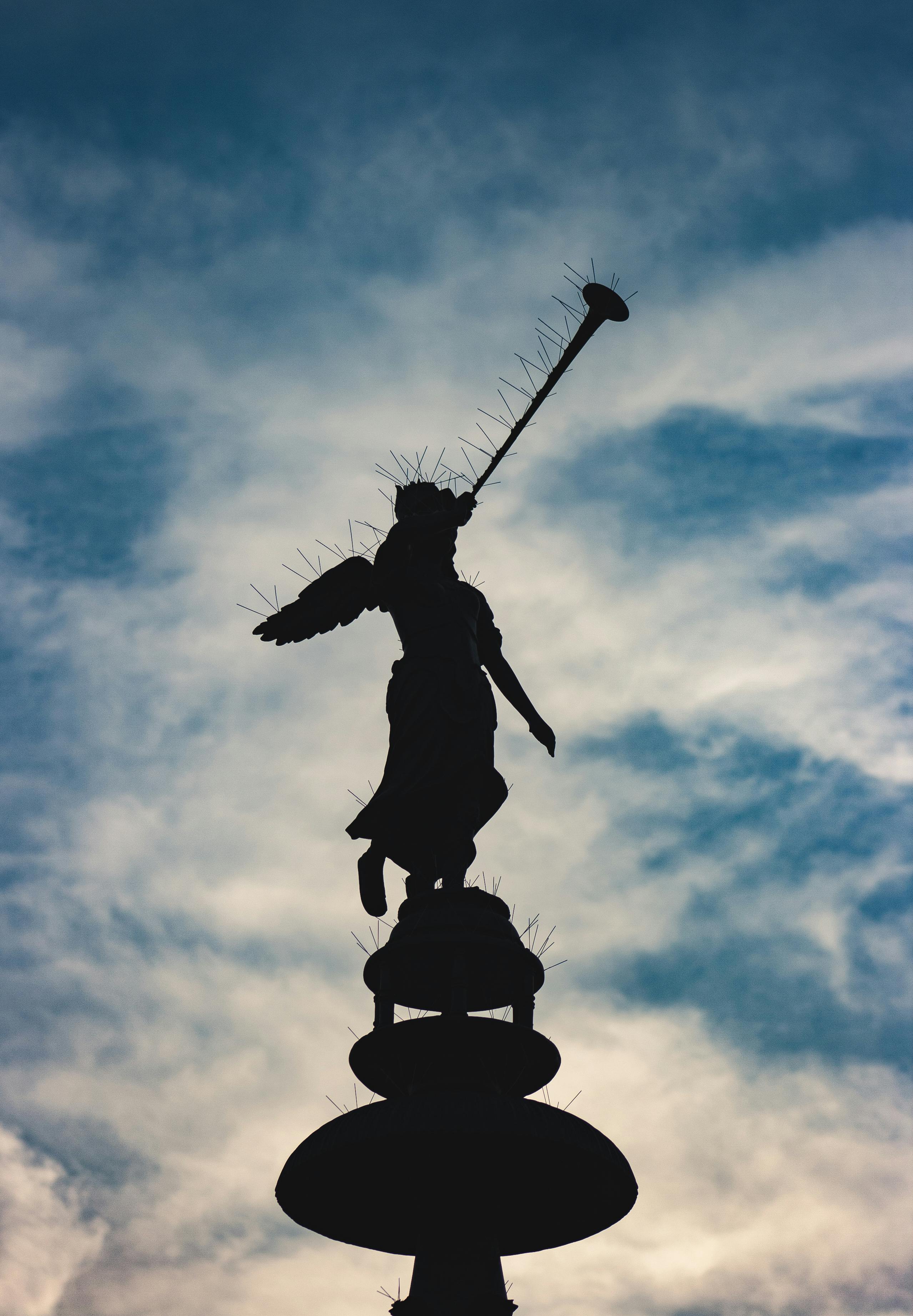Angel Sculpture Against Sky · Free Stock Photo