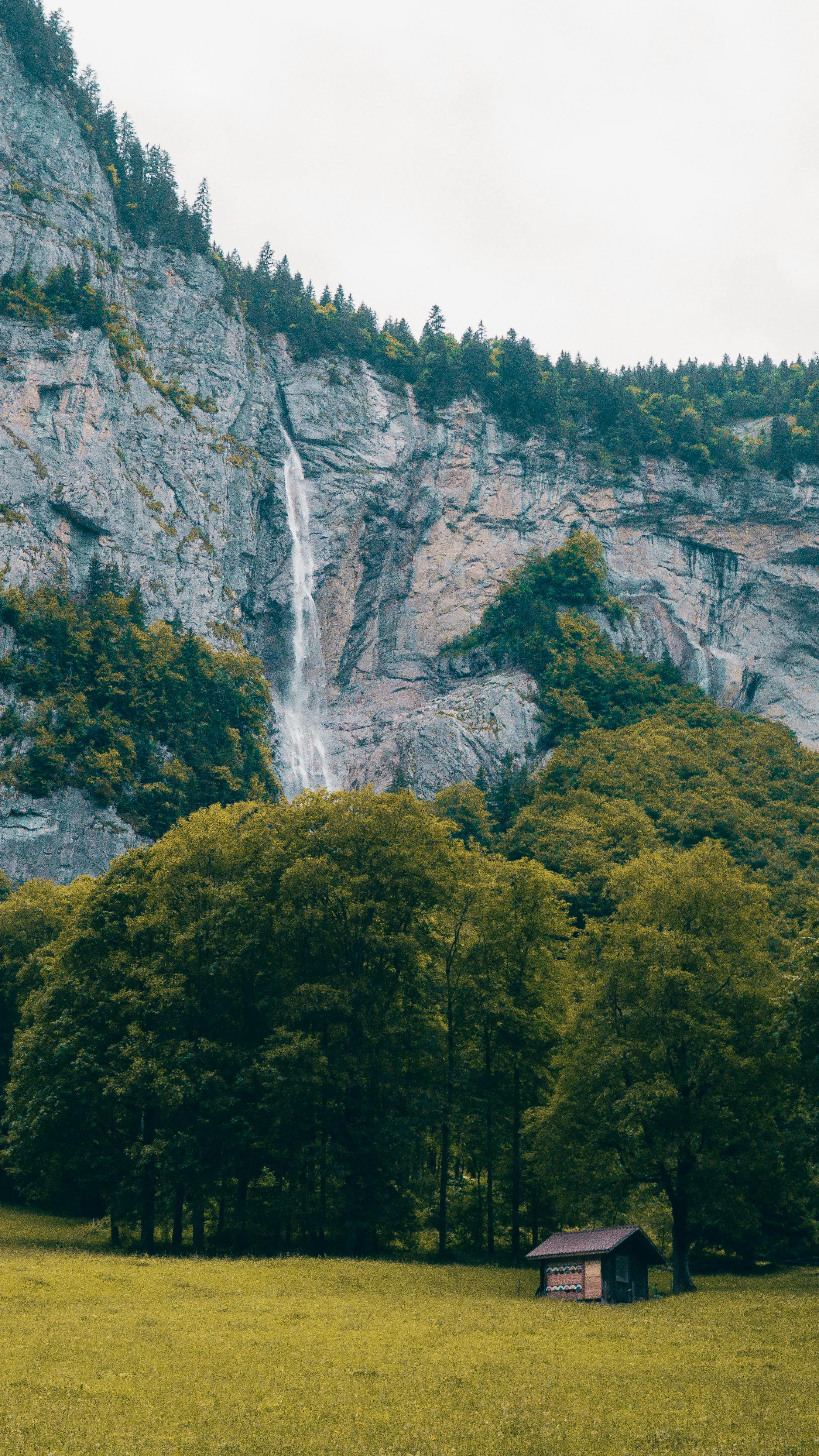 Waters falling from a Rock Formation · Free Stock Photo