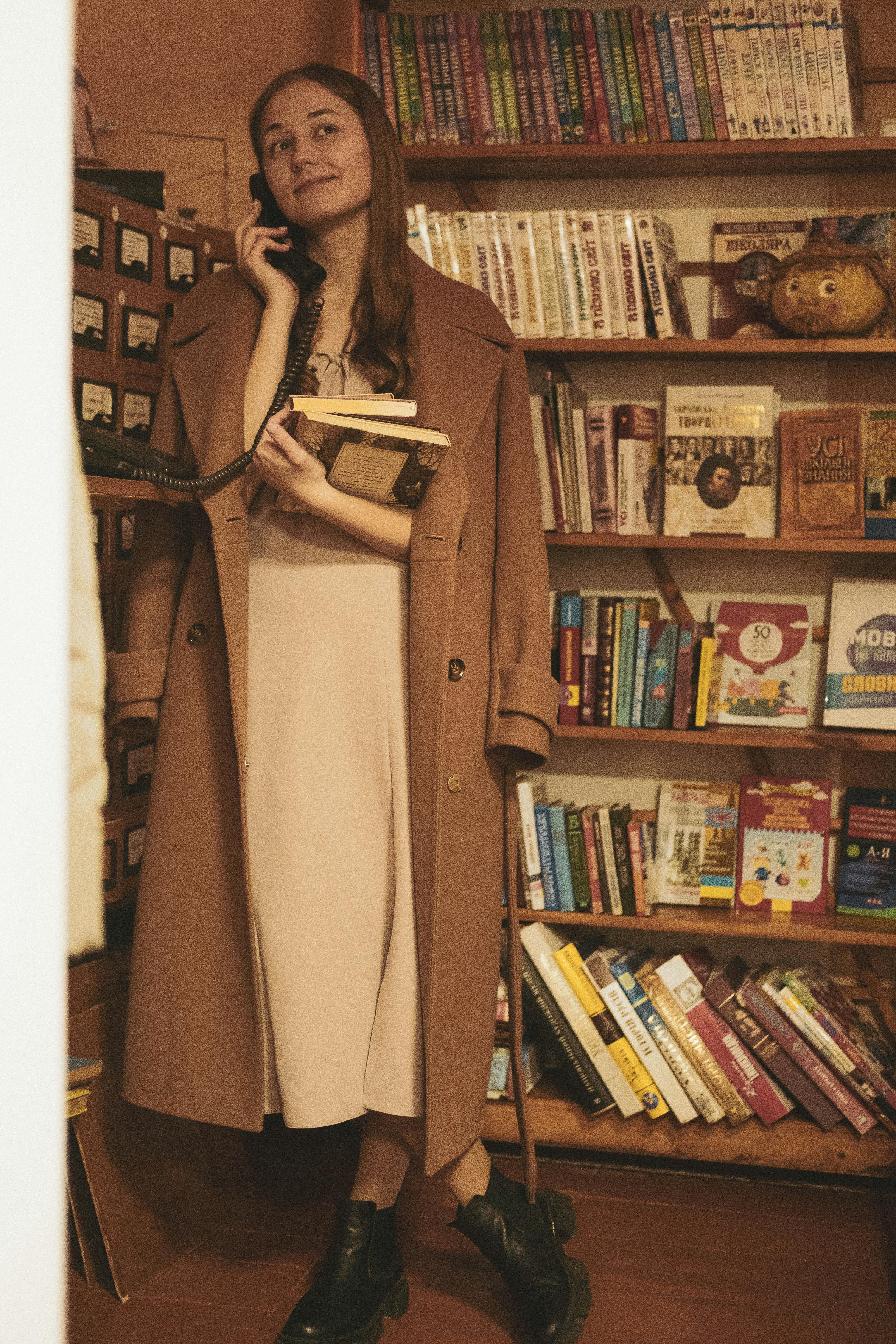 Young Woman in a Vintage Room with Books · Free Stock Photo