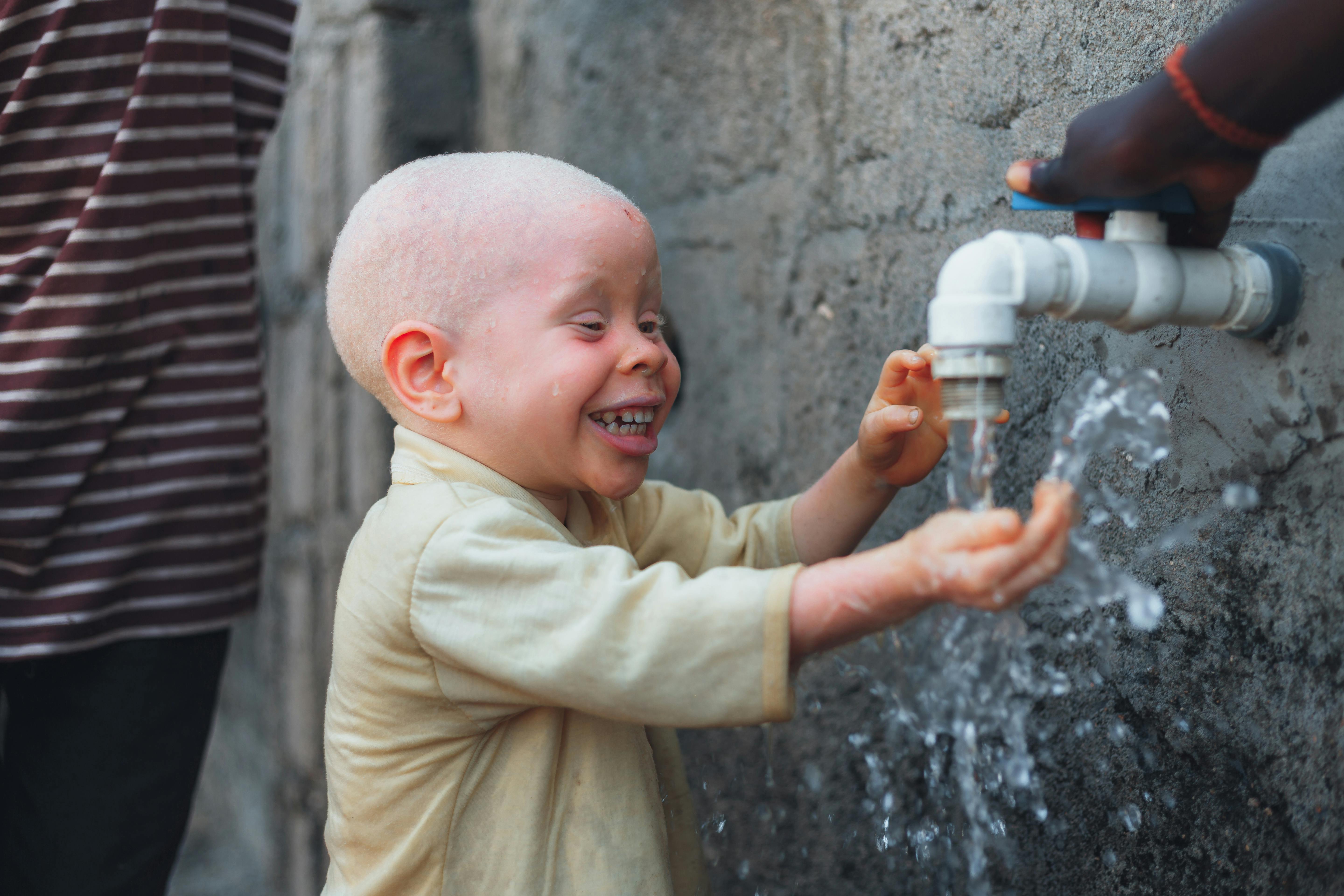Back View of Boy Washing Leg · Free Stock Photo