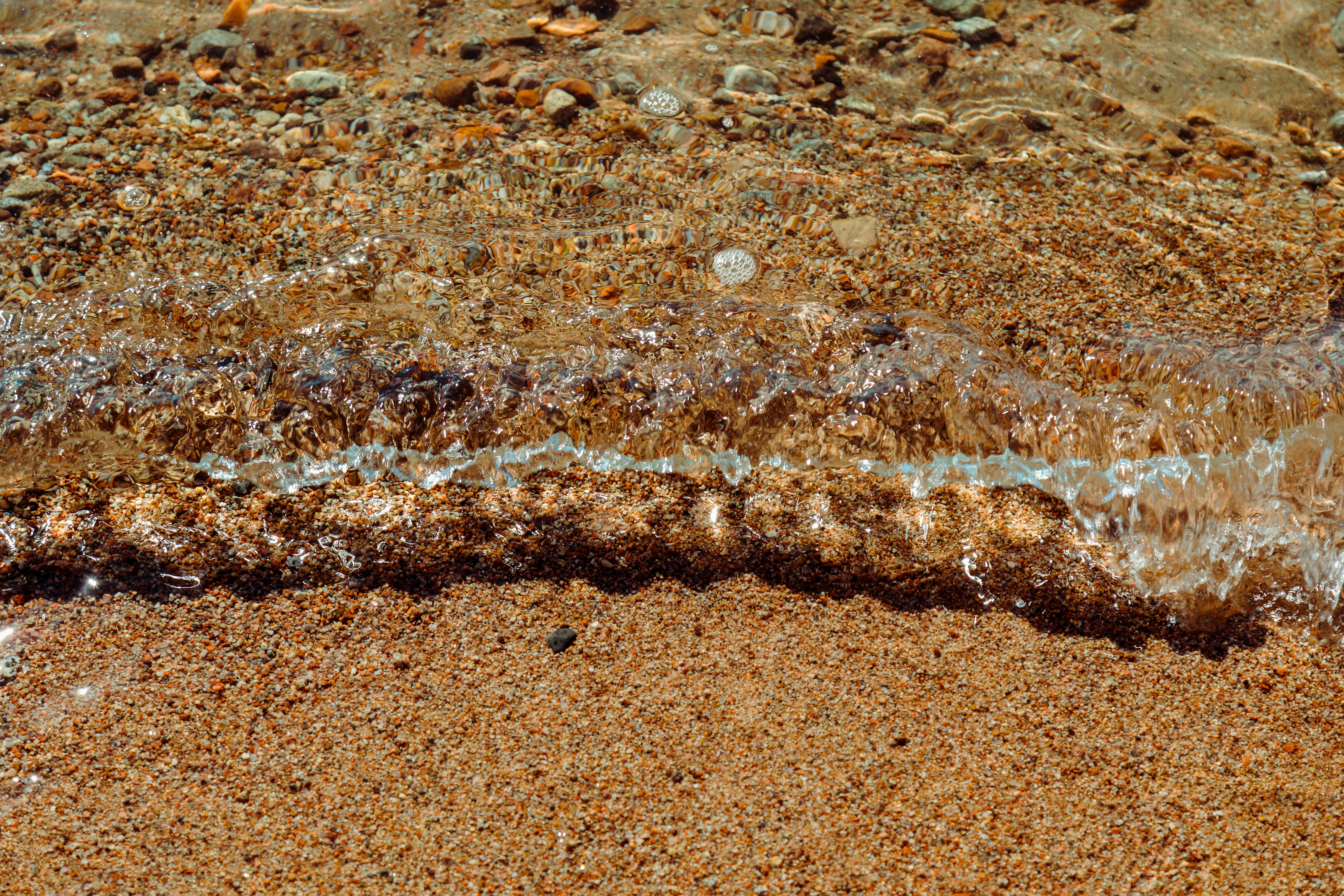 Close-Up Shot of Water on the Shore · Free Stock Photo