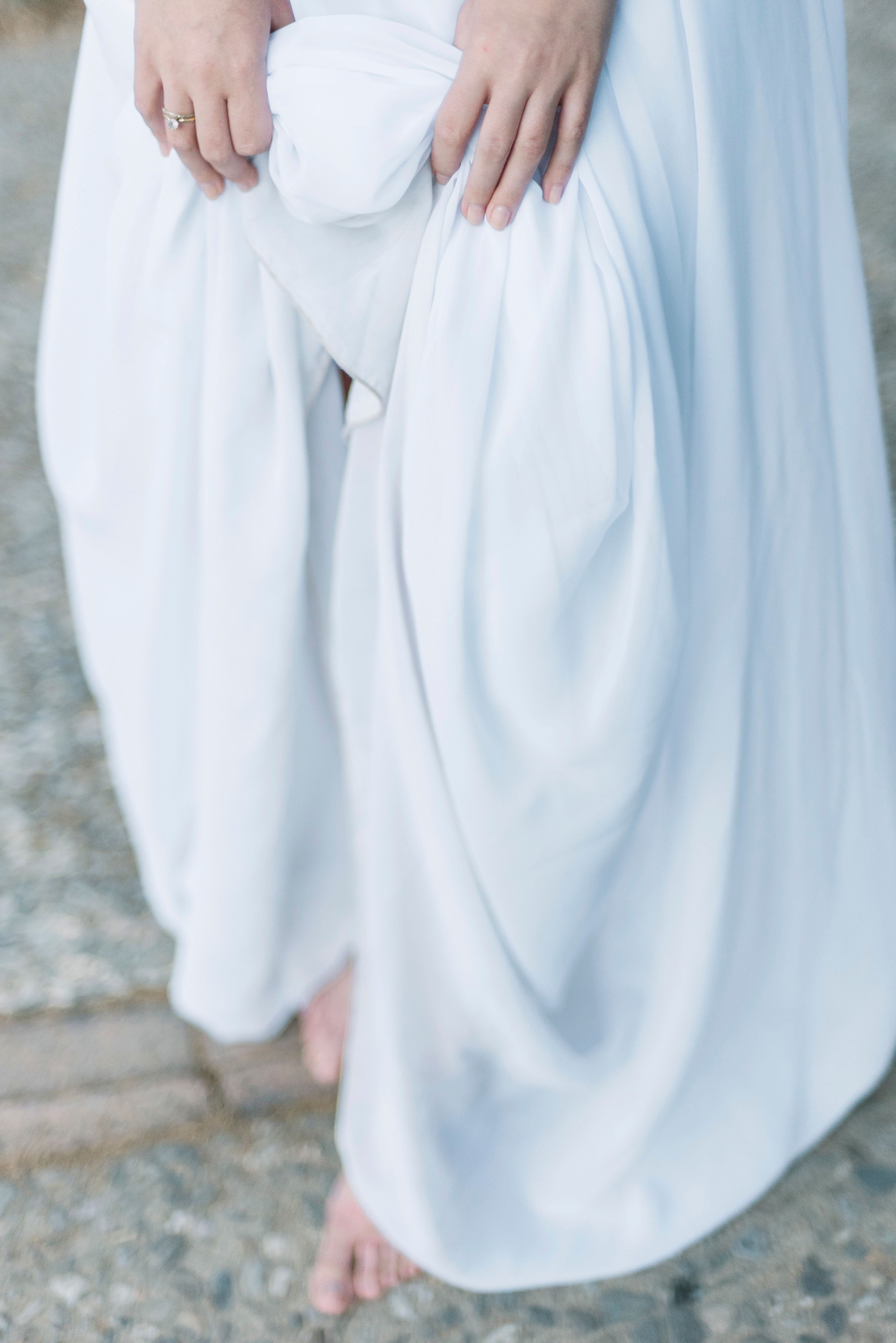 Woman Hands Holding White Clothes · Free Stock Photo