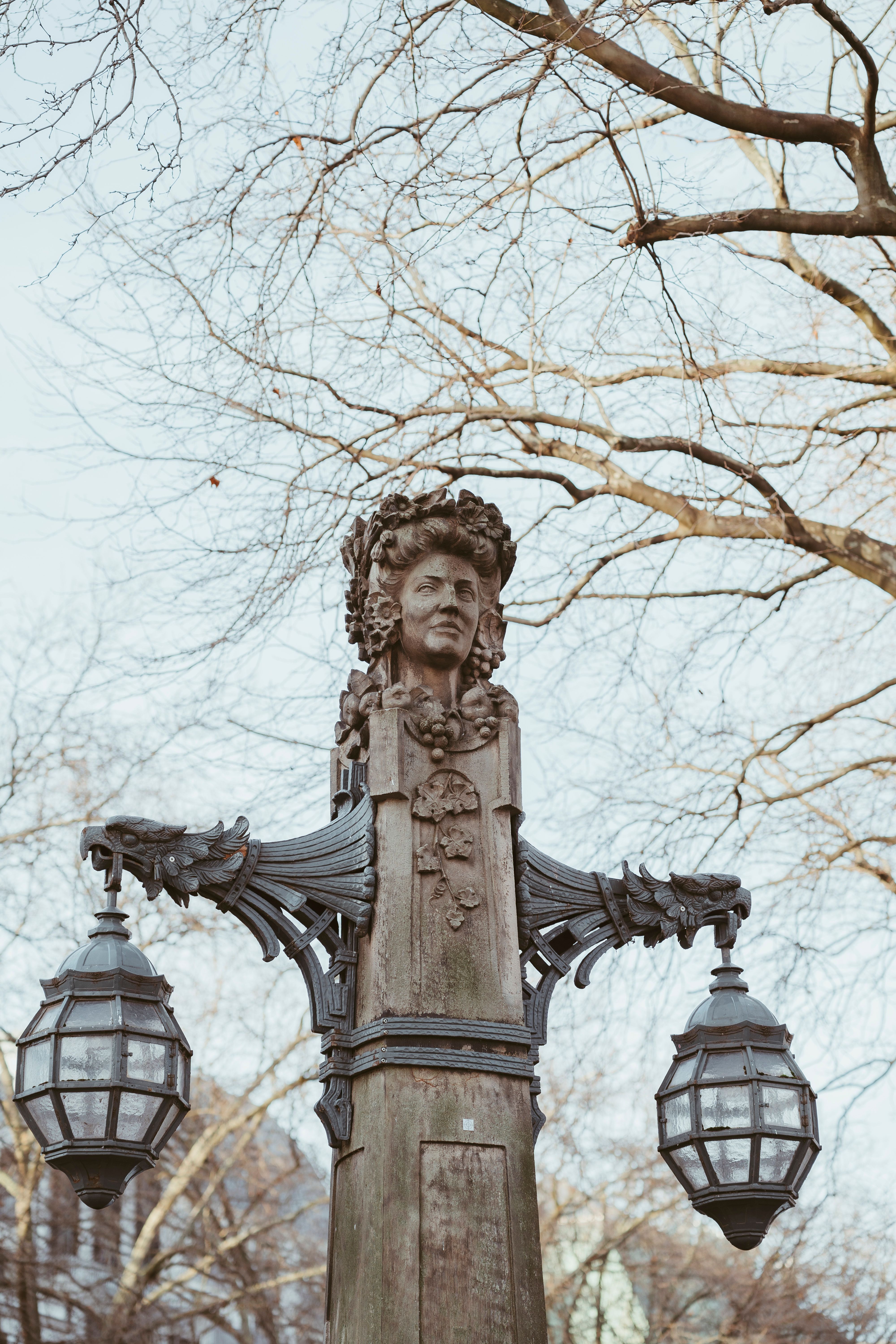 Statue with Hanging Lanterns · Free Stock Photo