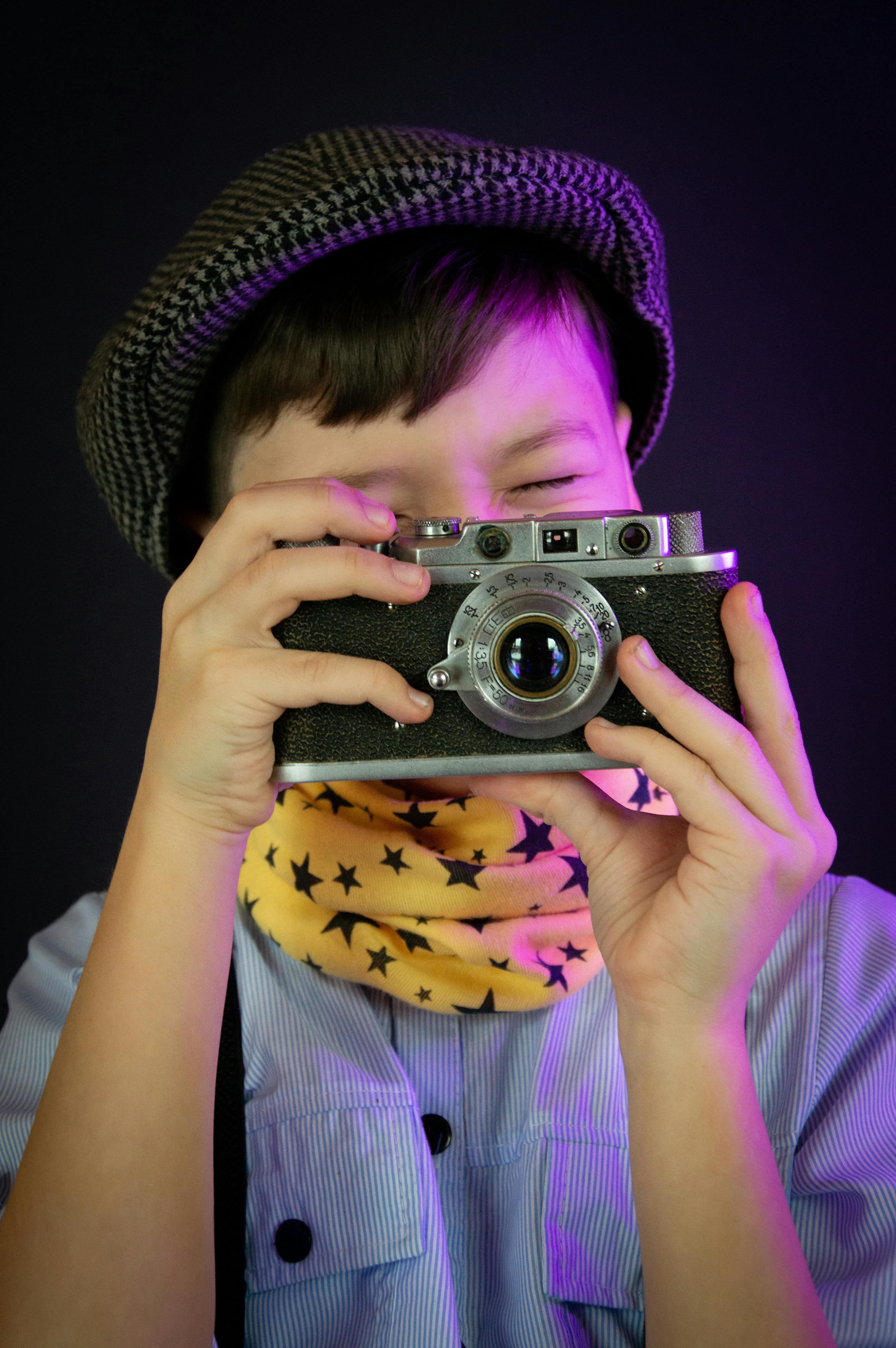 Boy Taking a Photo with a Vintage Camera · Free Stock Photo