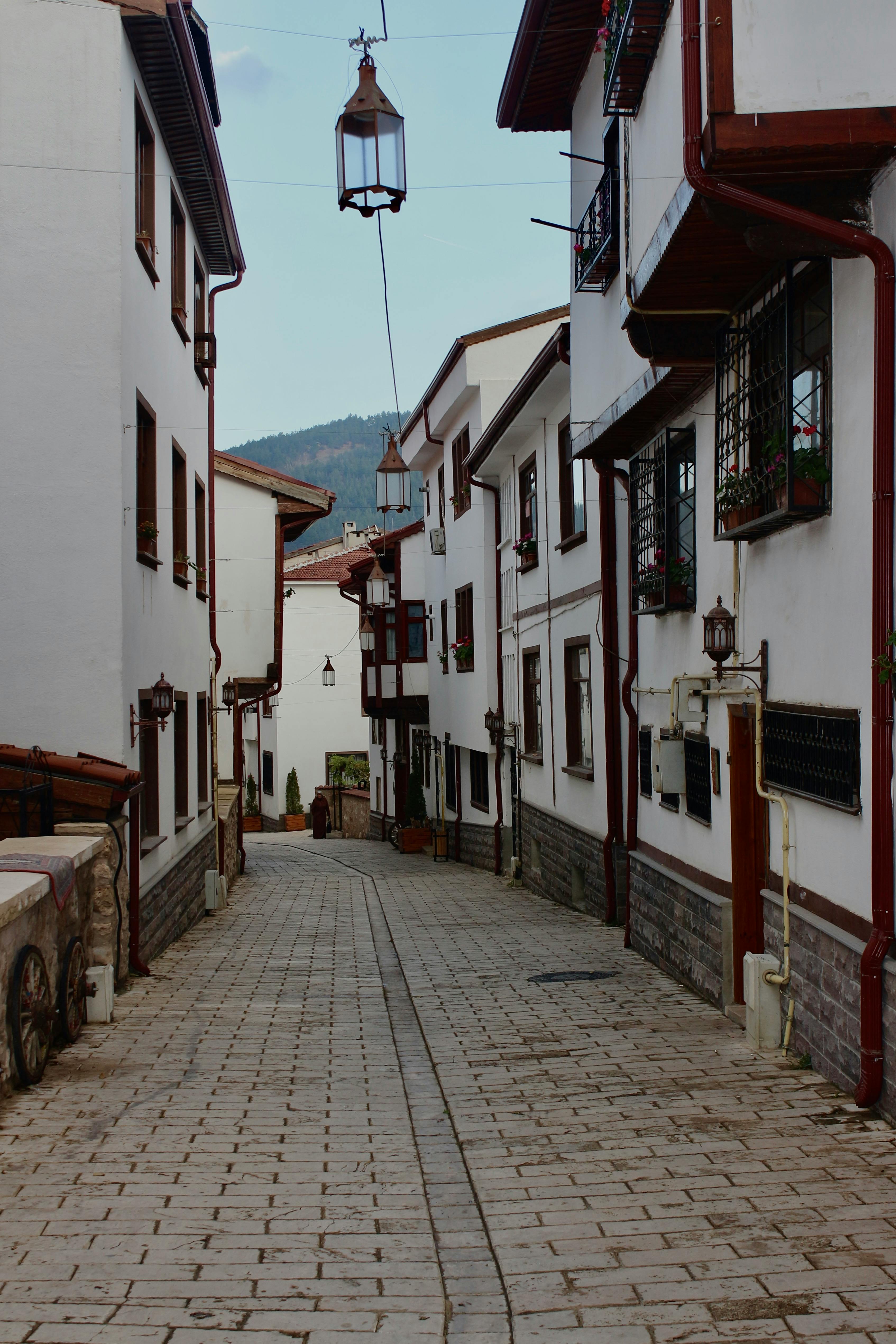 A Narrow Passage between Concrete Wall and Columns · Free Stock Photo