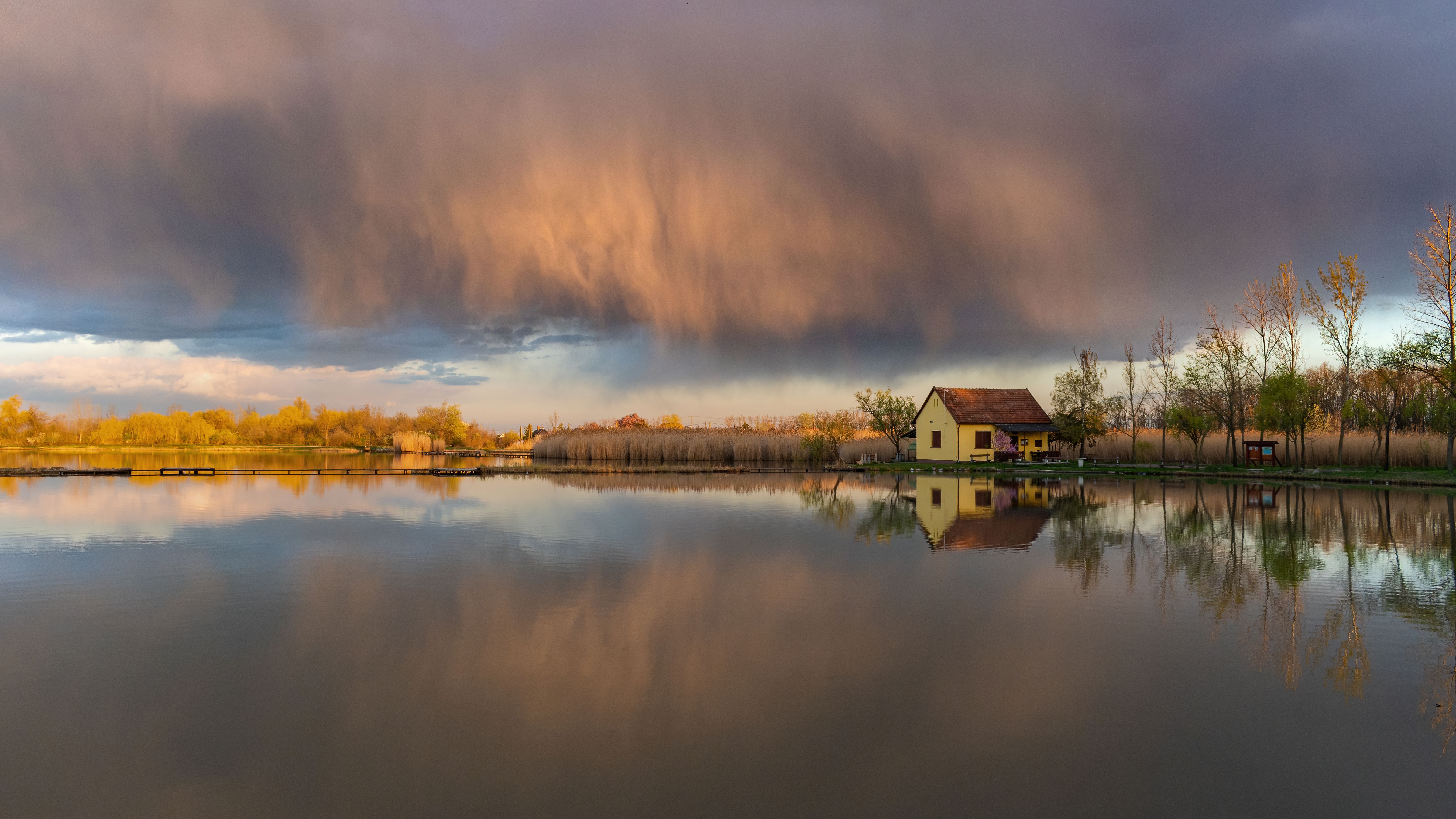 House Built on Shore Reflecting in Lake Surface · Free Stock Photo
