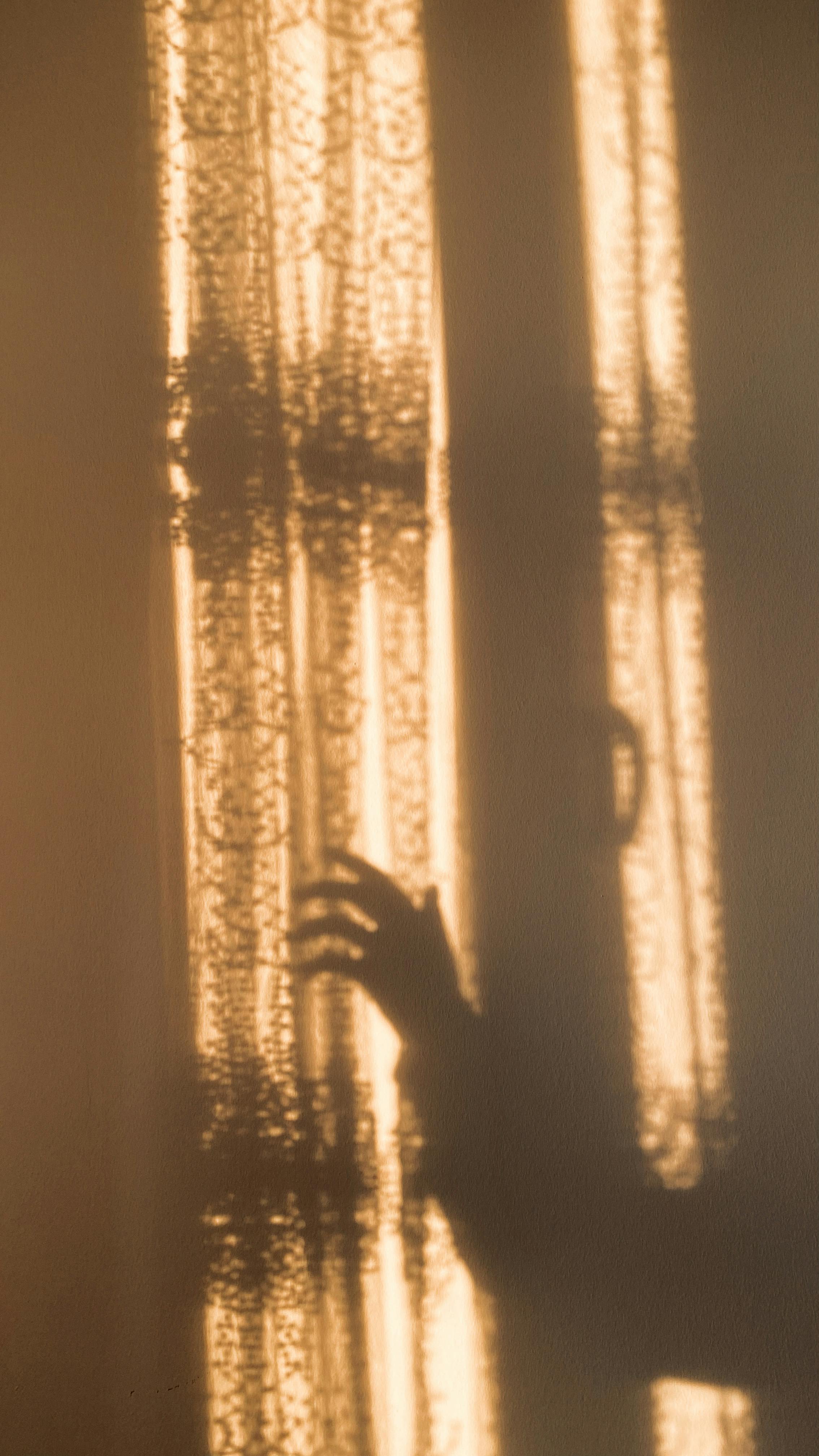 Hand by the Window Curtain · Free Stock Photo