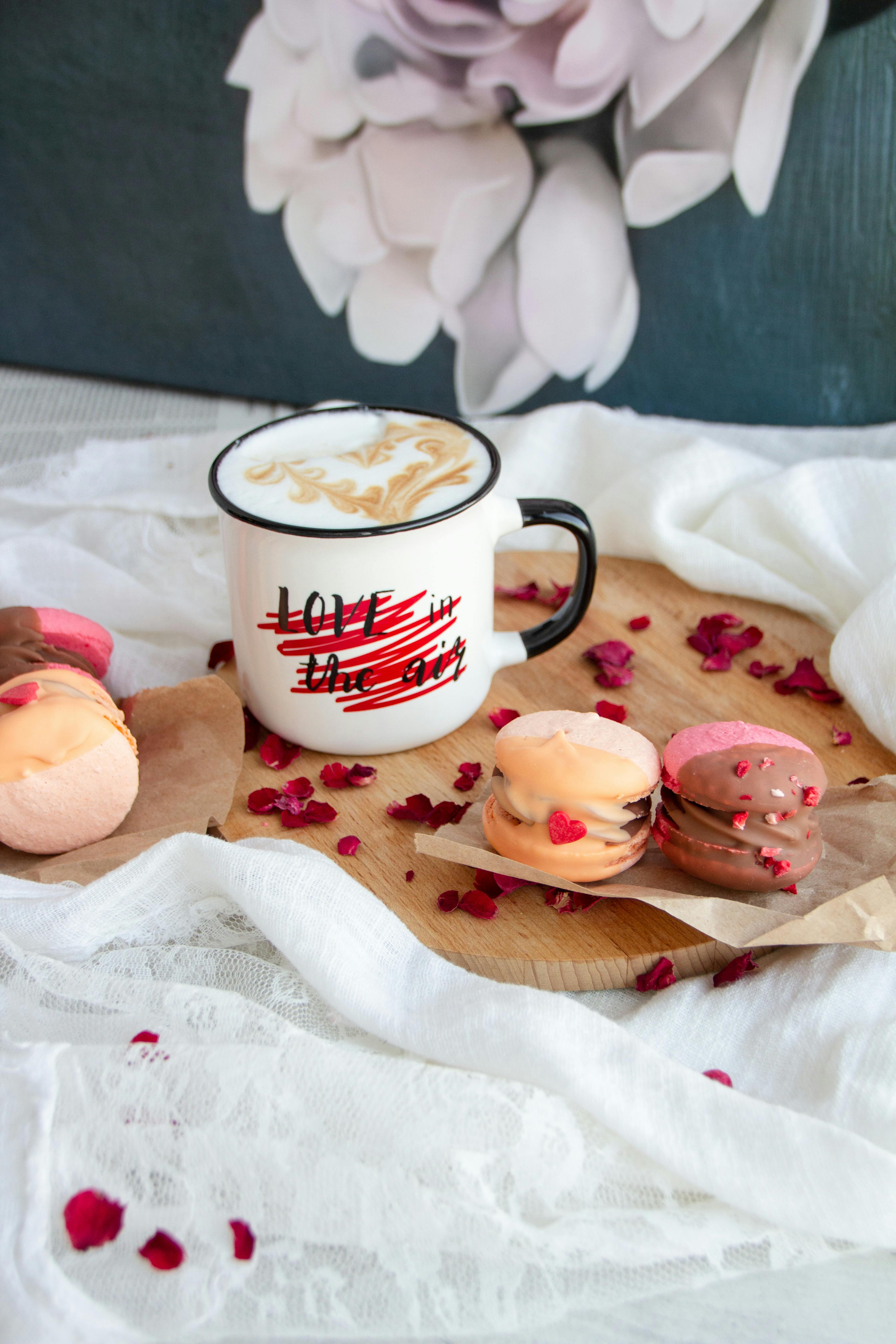 Cup of Coffee and Macarons on Board · Free Stock Photo