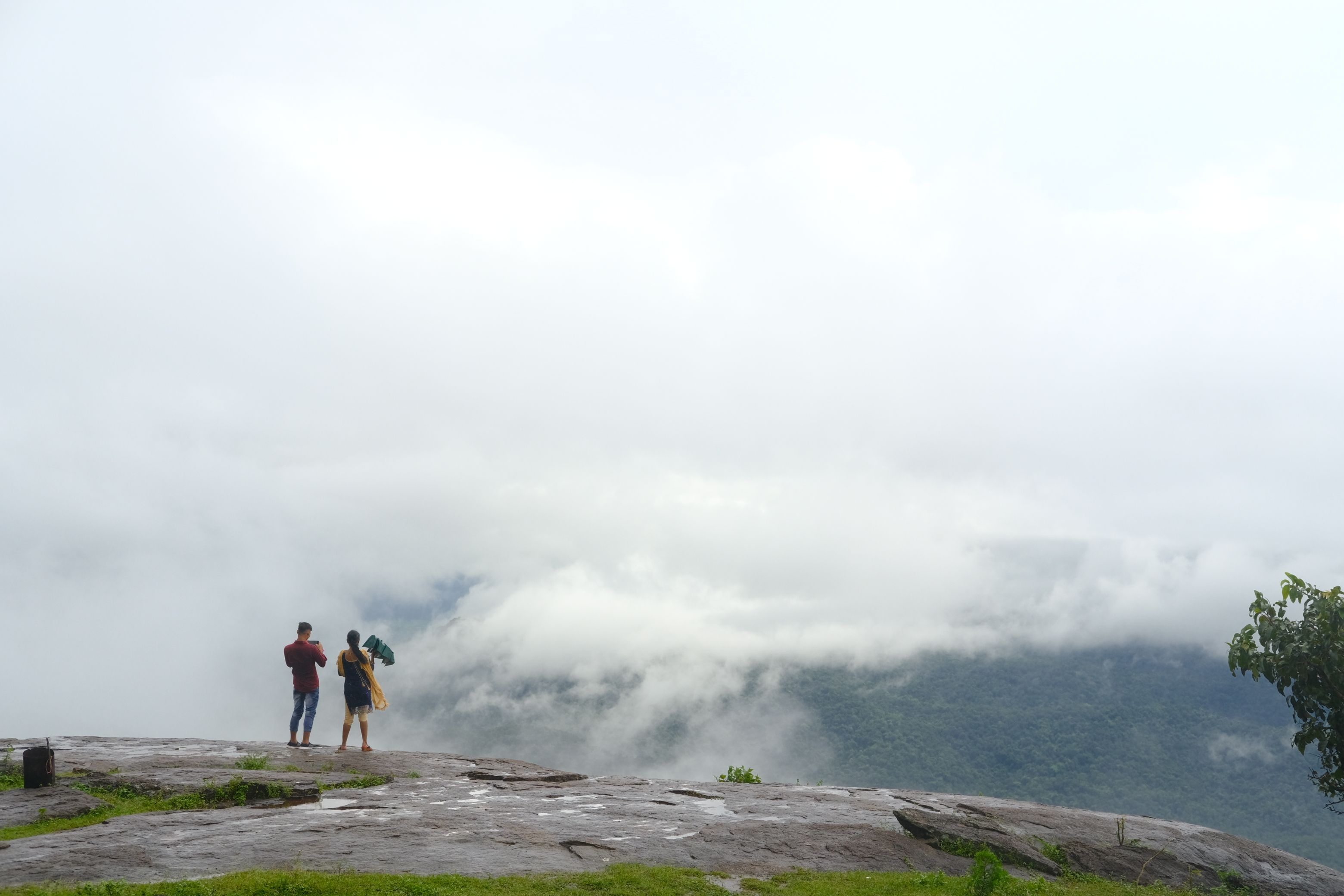 Two People Standing Above a Valley · Free Stock Photo