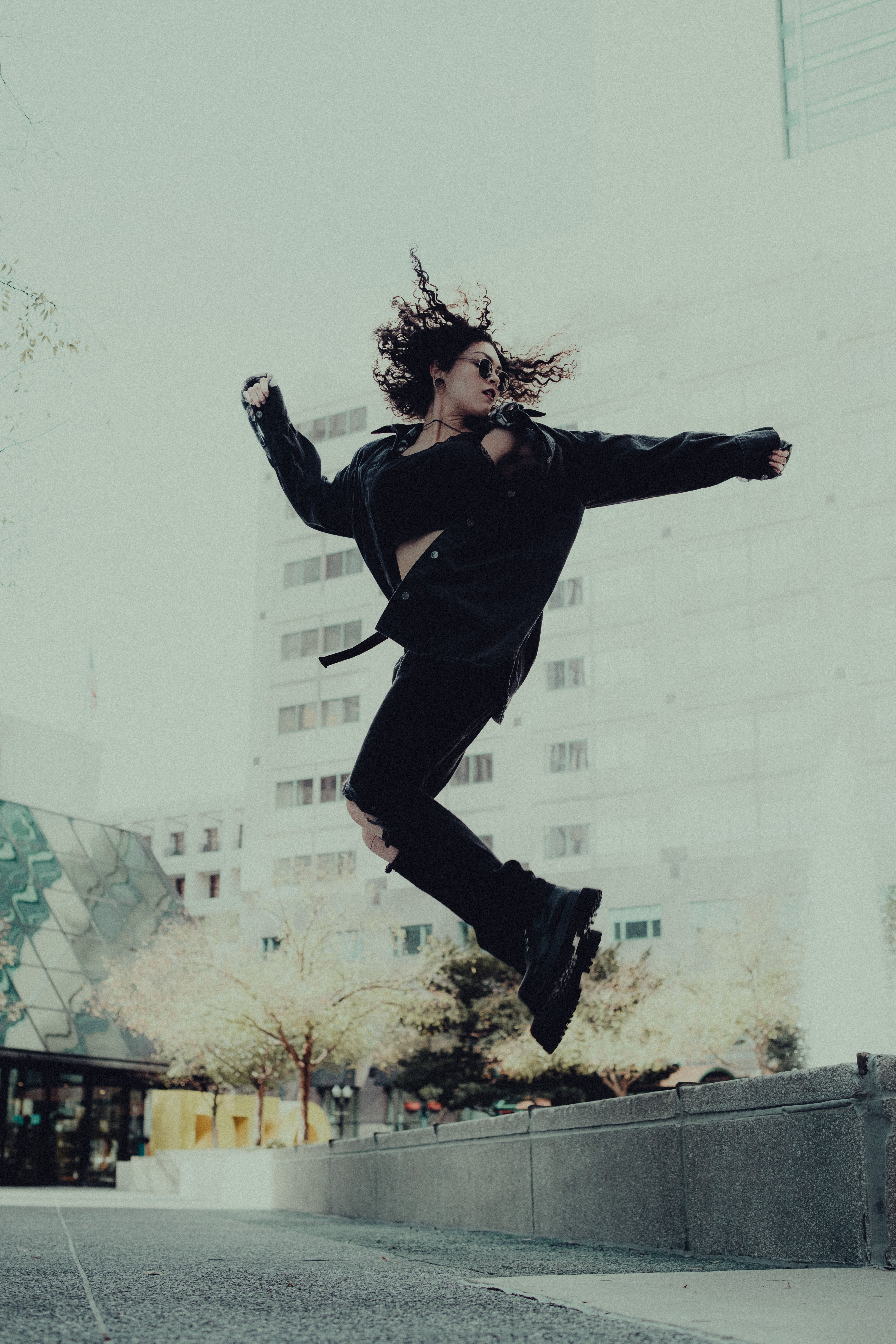 Woman Standing on Car's Roof · Free Stock Photo