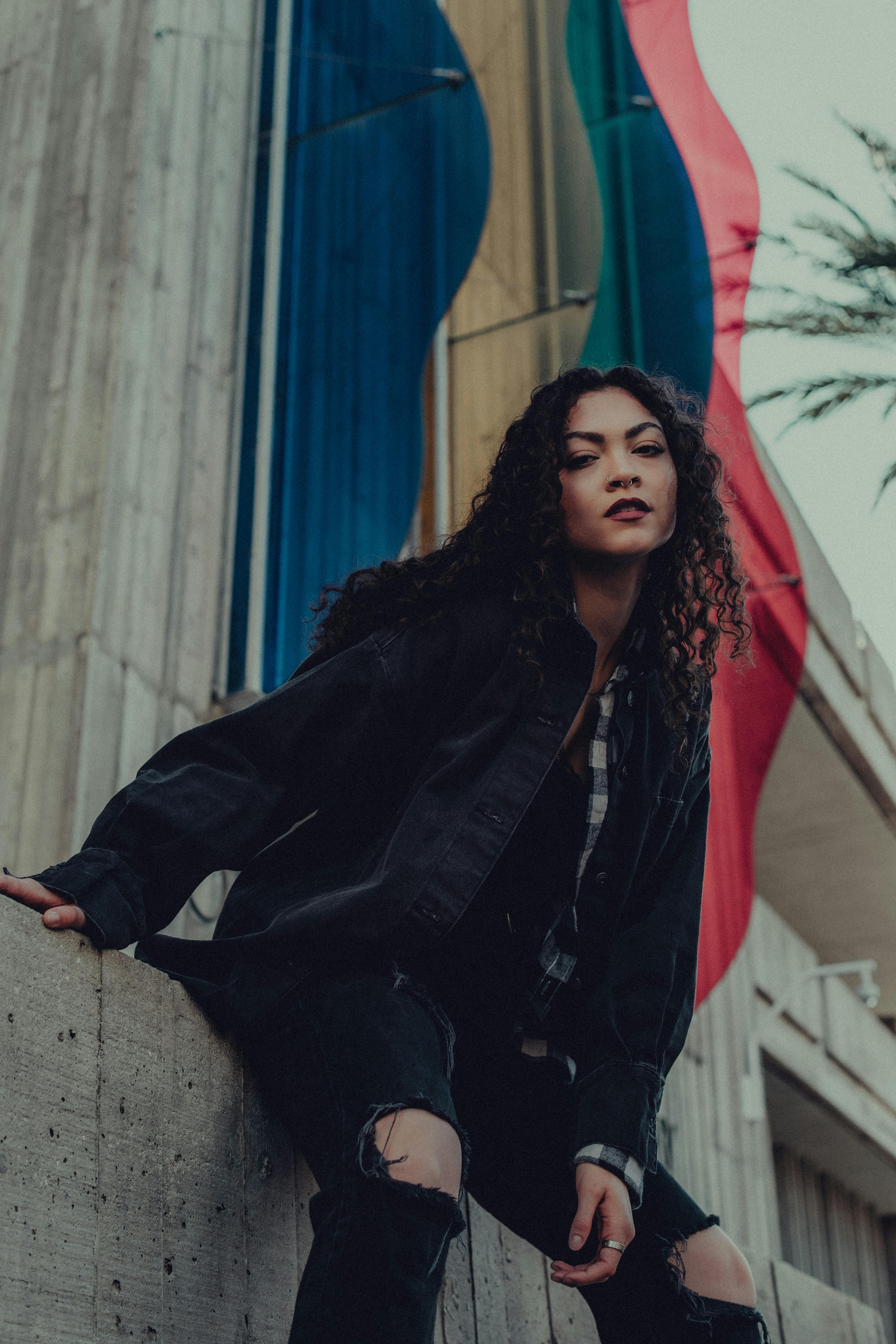 Photo of Man Sitting While Holding Cup · Free Stock Photo