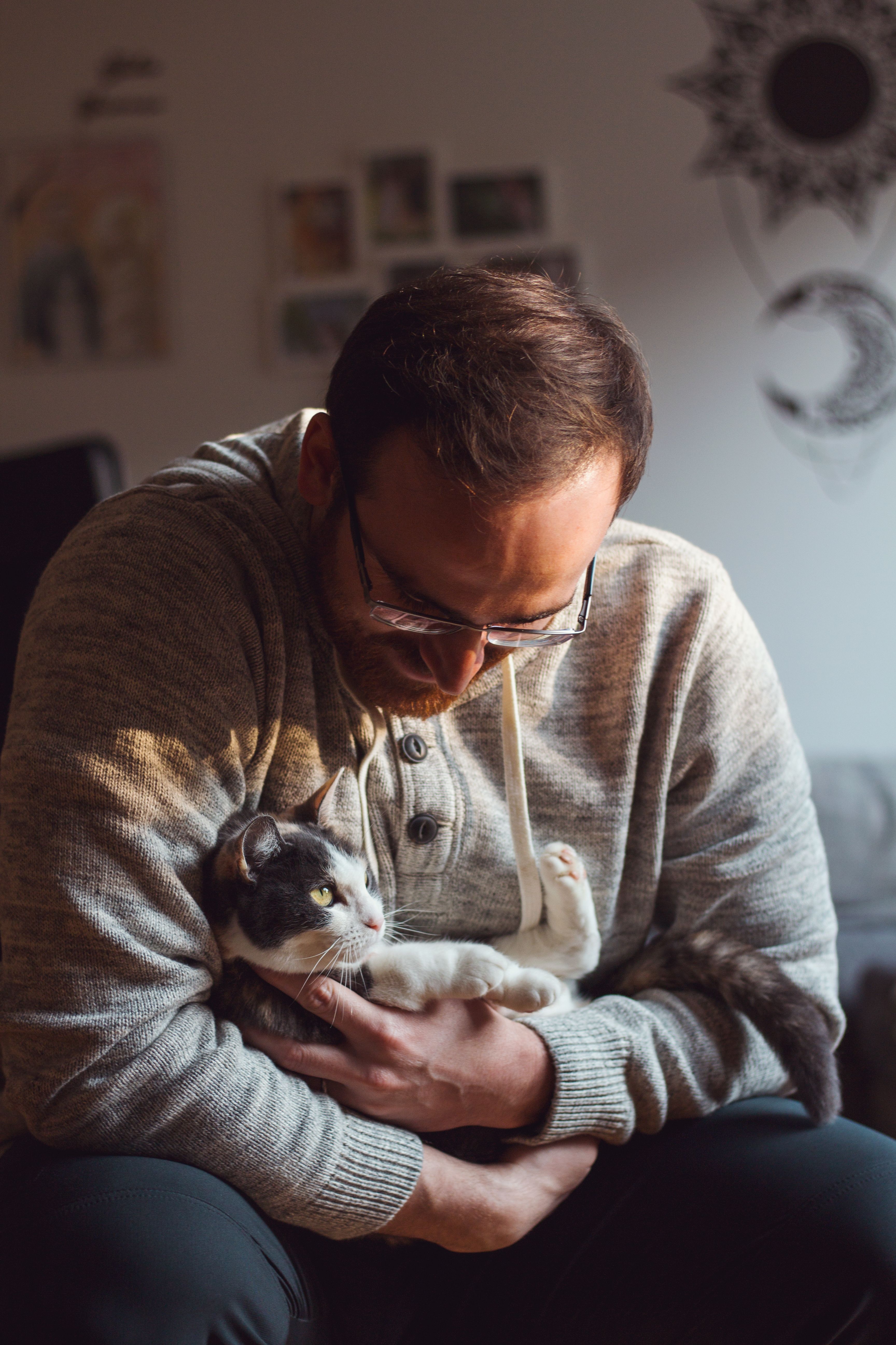 Man Sitting with Cat · Free Stock Photo