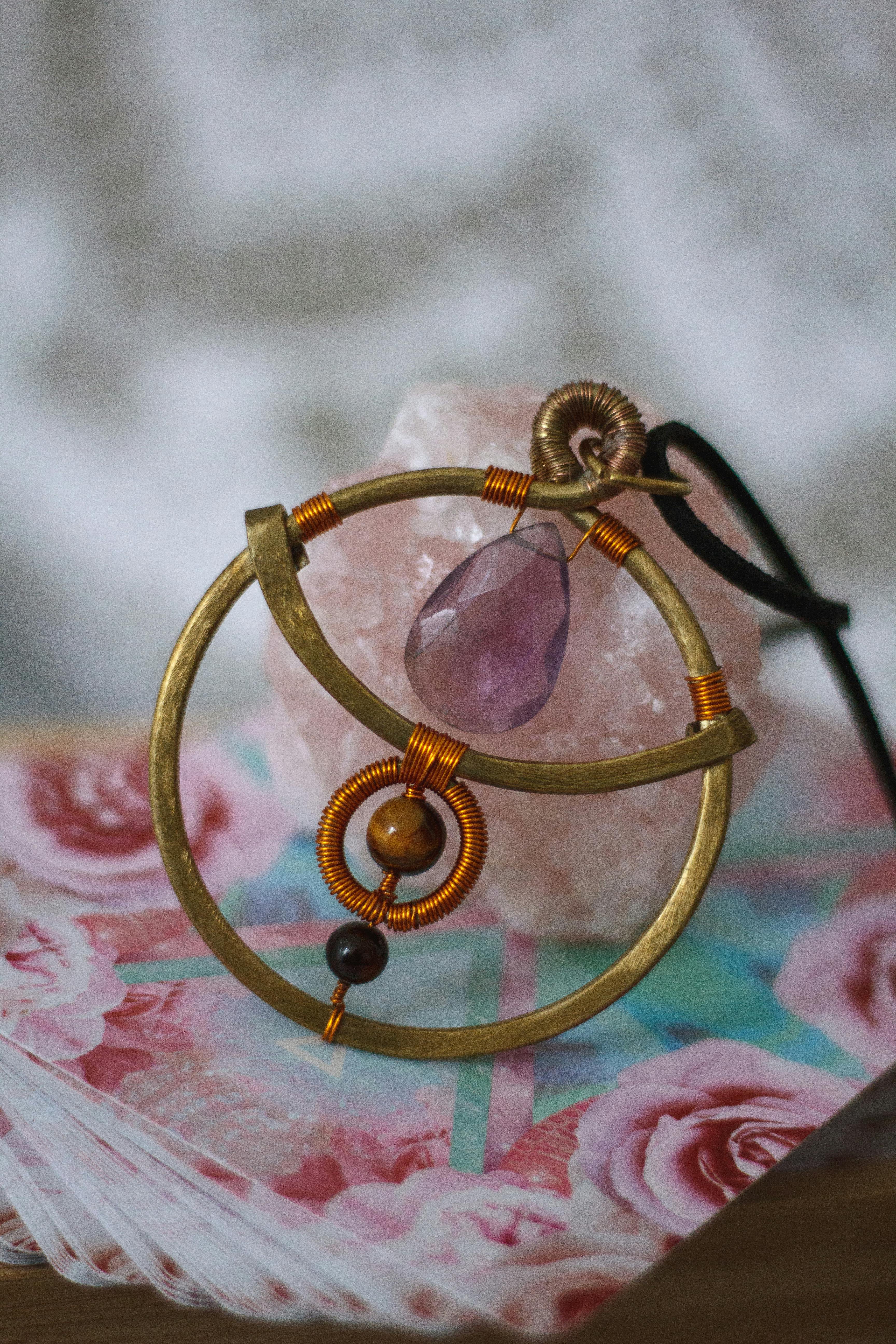 Close-up of an Amulet with a Crystal Stone · Free Stock Photo