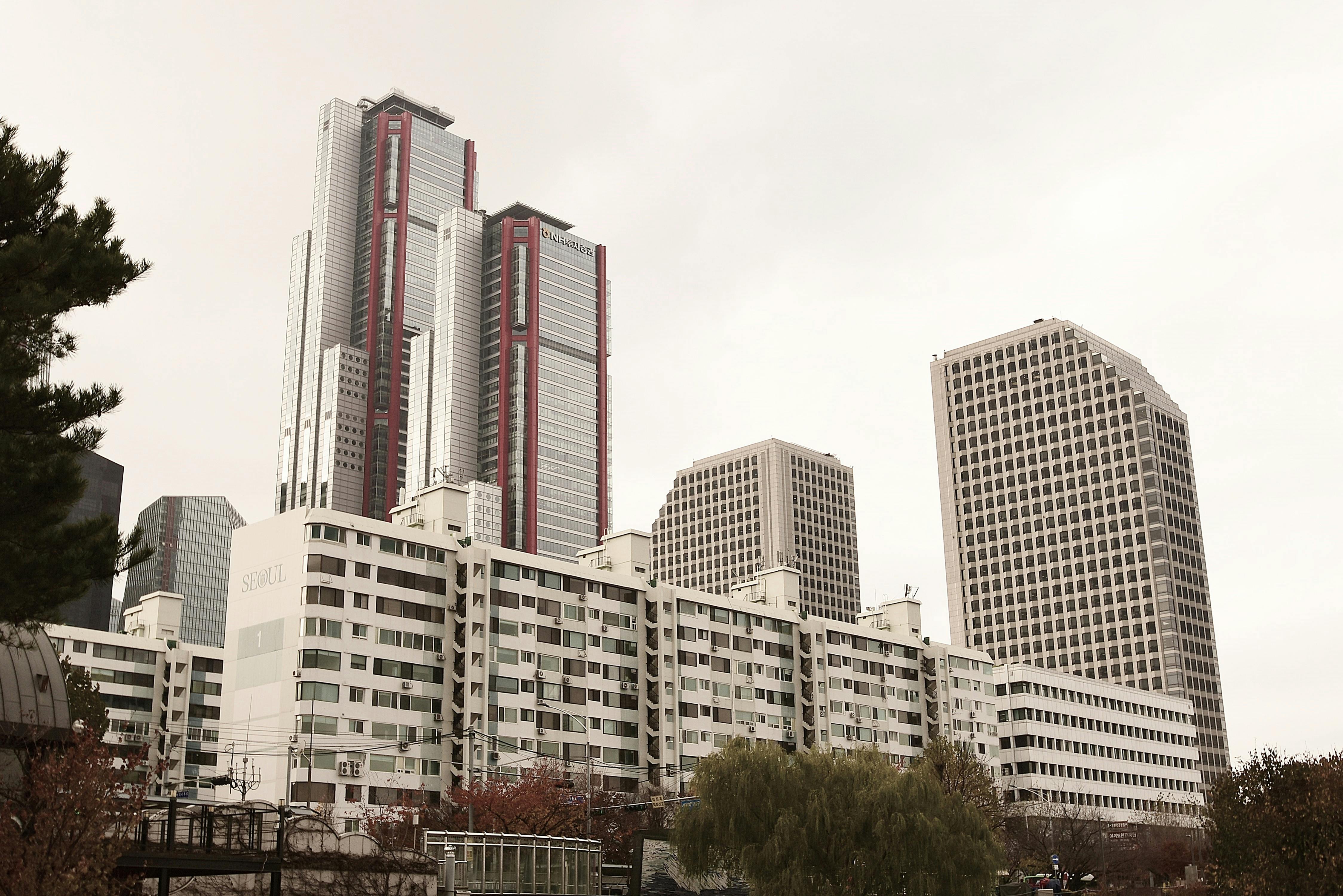Tall Buildings Surrounded by Trees · Free Stock Photo