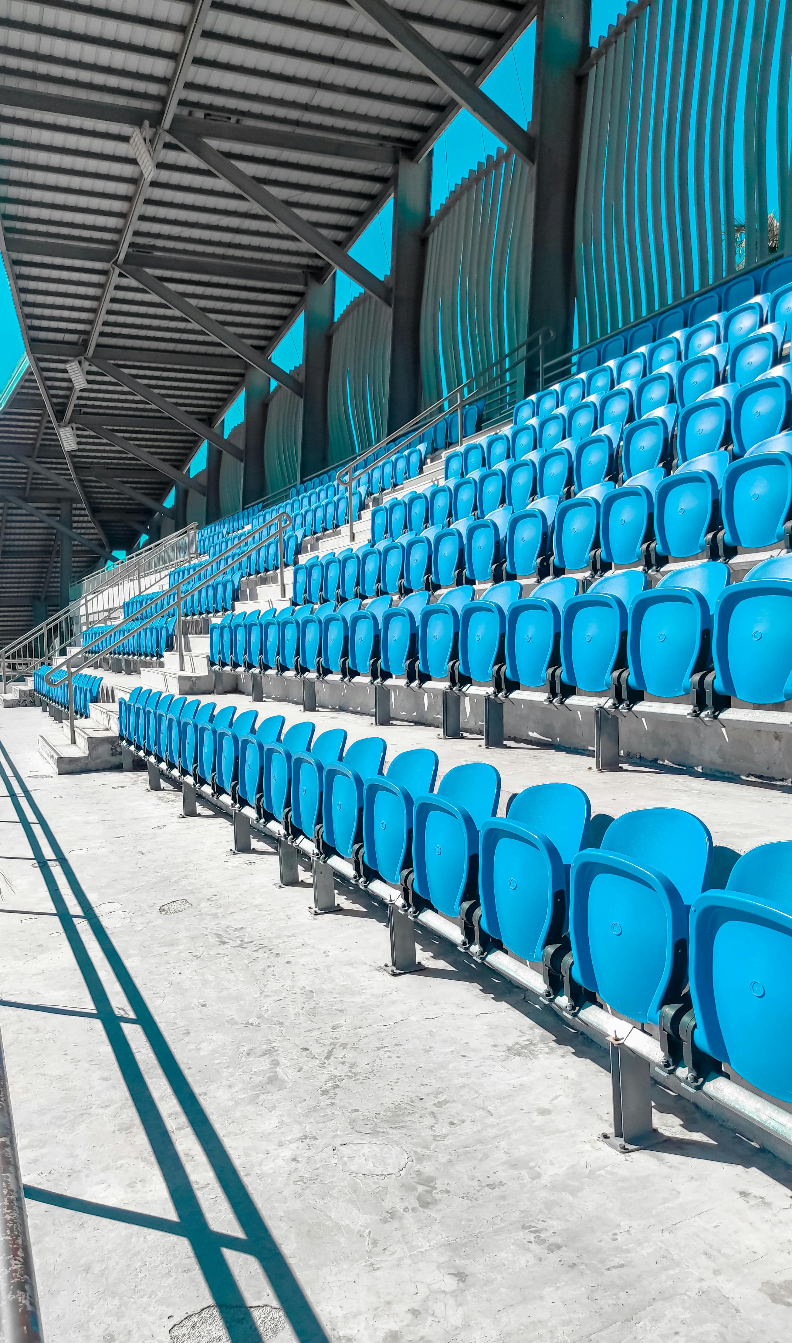 Red and Black Stadium Seats · Free Stock Photo