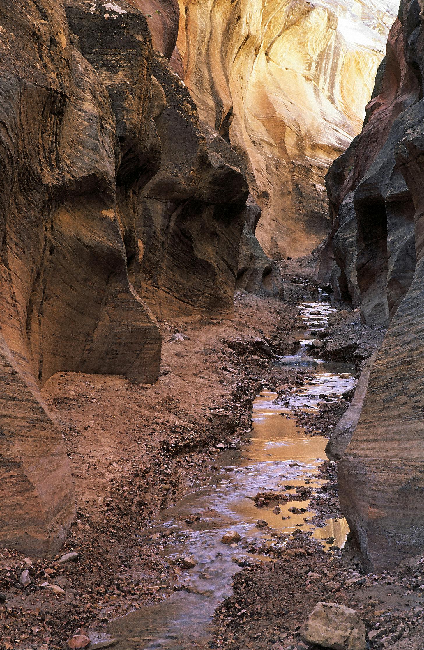 Close Up Photo of Black Rock Formation With Litter Amount of River in ...