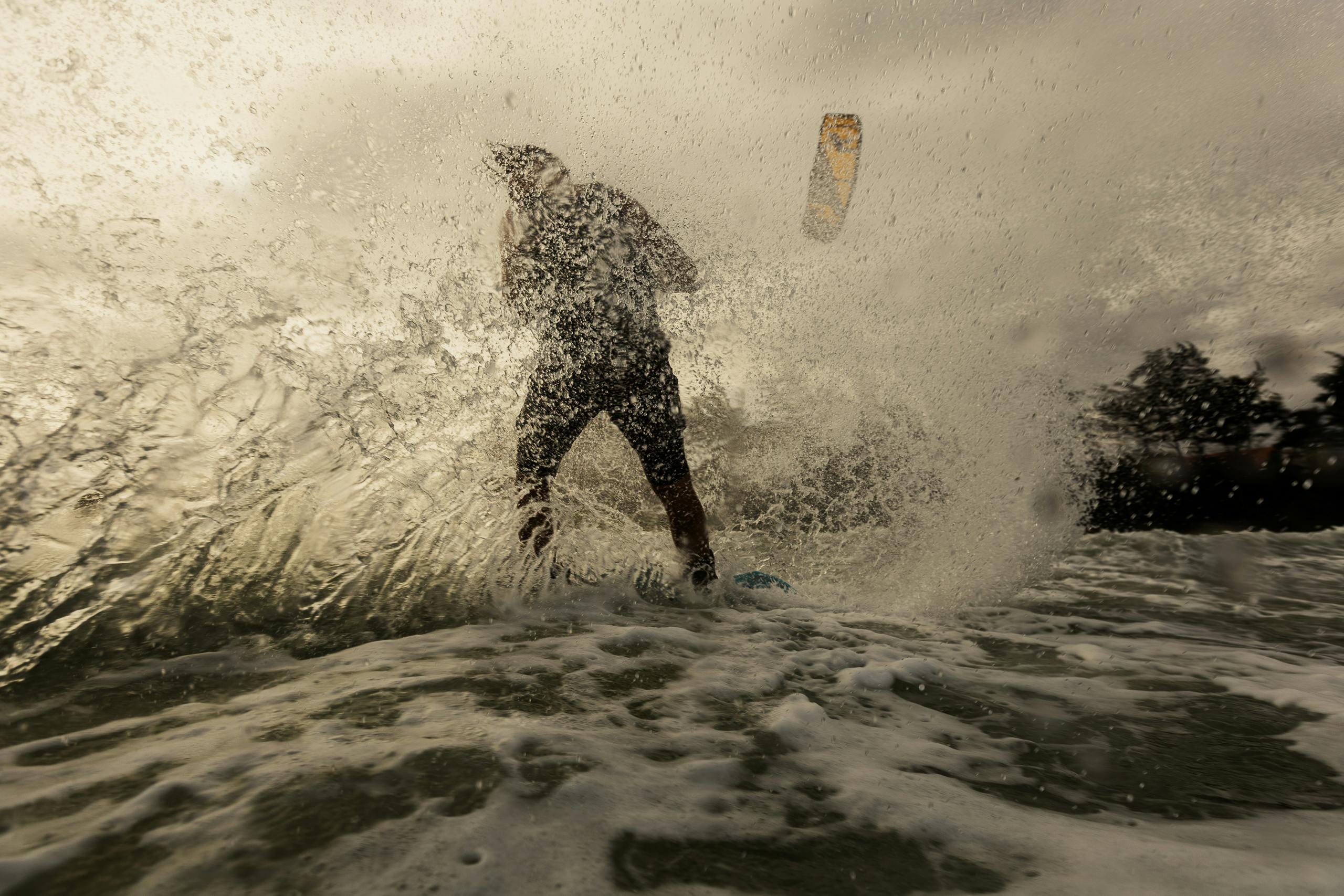 Person Riding Surf Board · Free Stock Photo