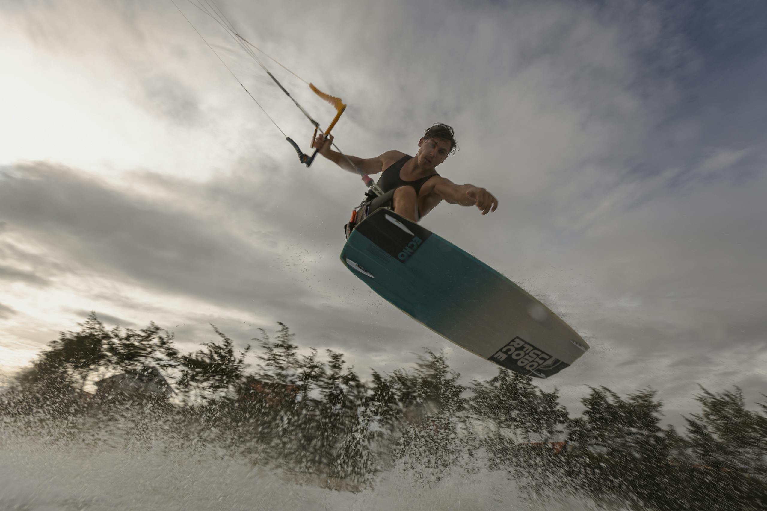 Back View of a Man Kitesurfing in Sea · Free Stock Photo