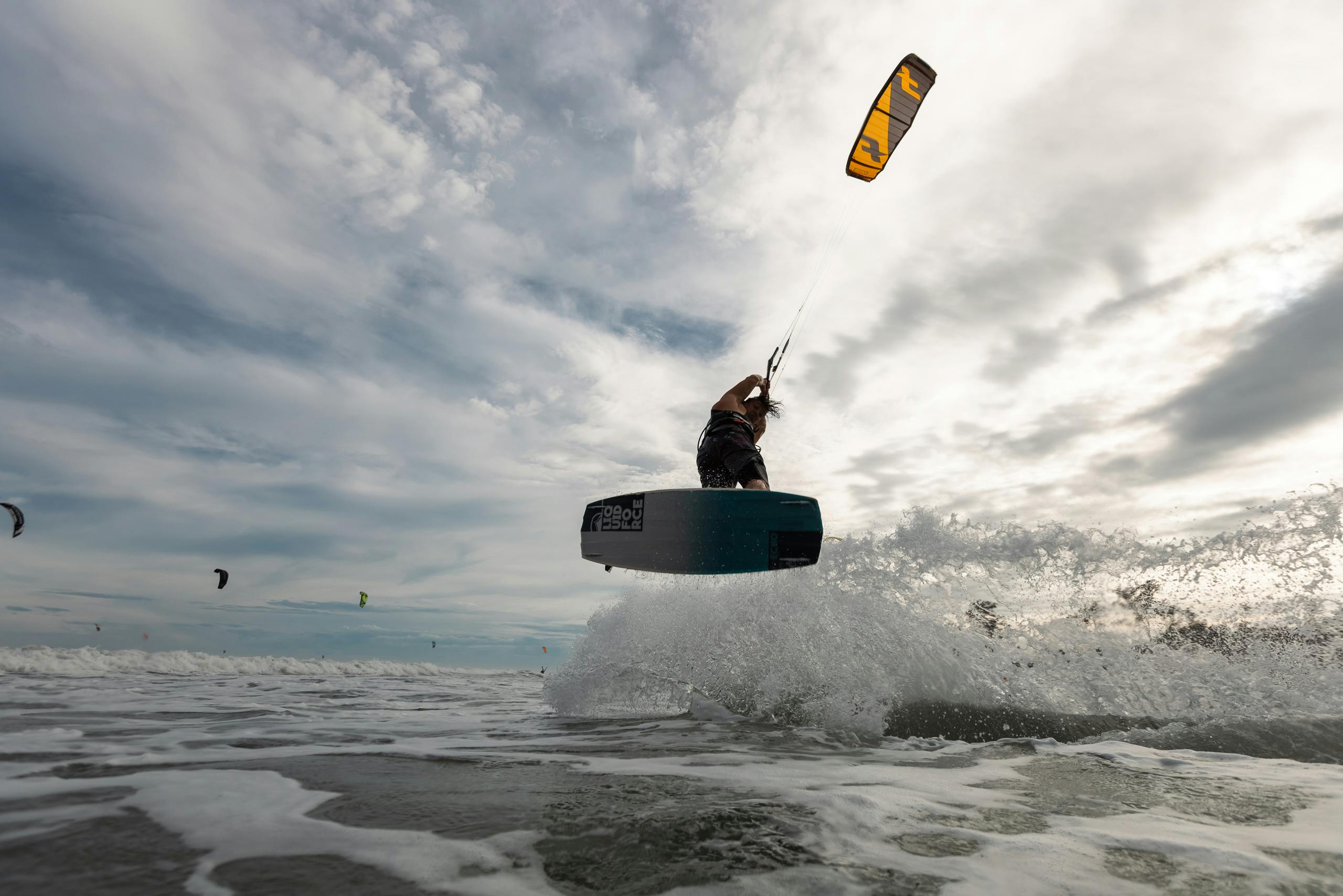 Back View of a Man Kitesurfing in Sea · Free Stock Photo