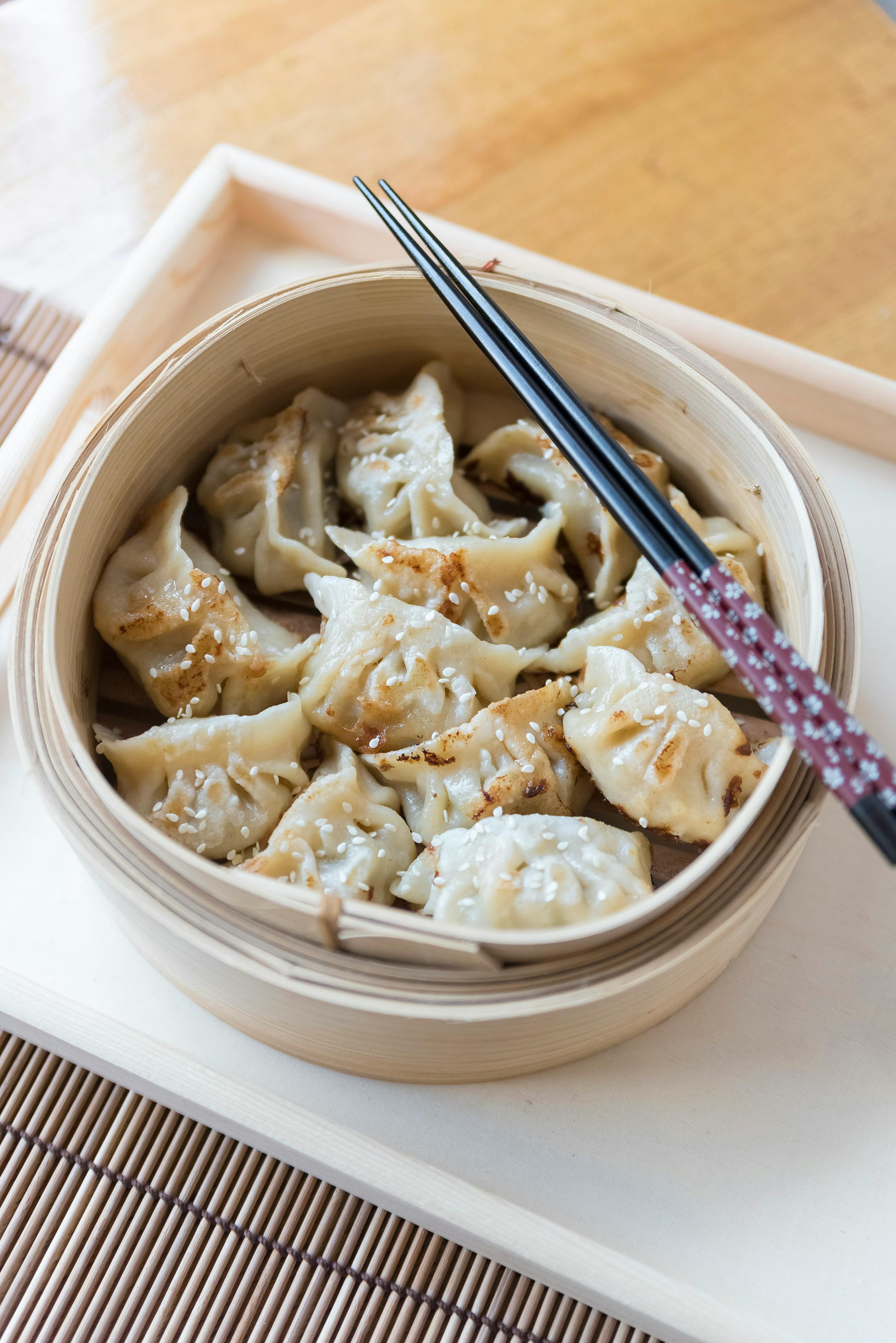 Fried Spring Rolls and Dumplings on Top of Tray · Free Stock Photo